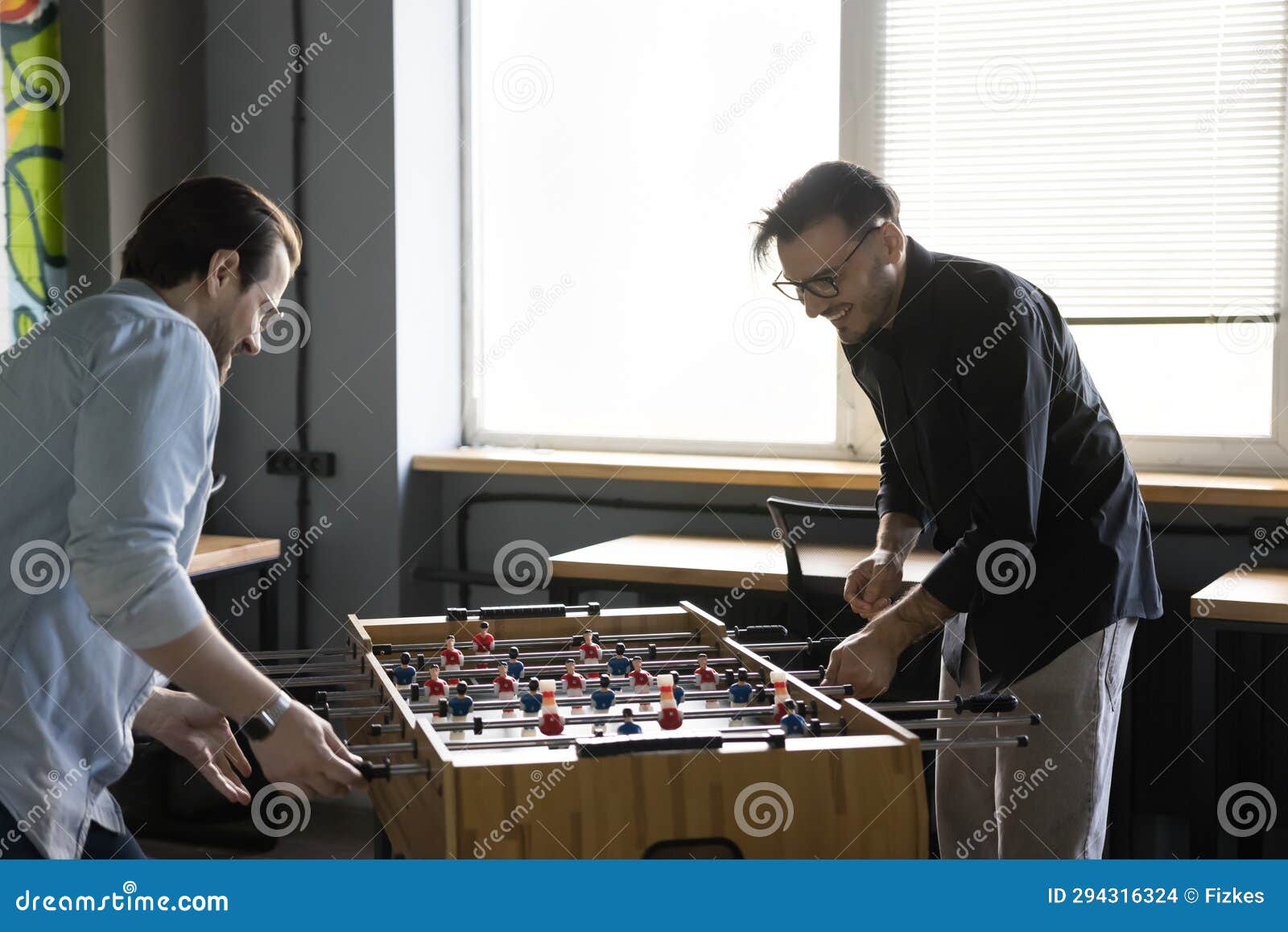 Two Excited Colleagues Having Fun at Workplace during Lunch Break Stock ...