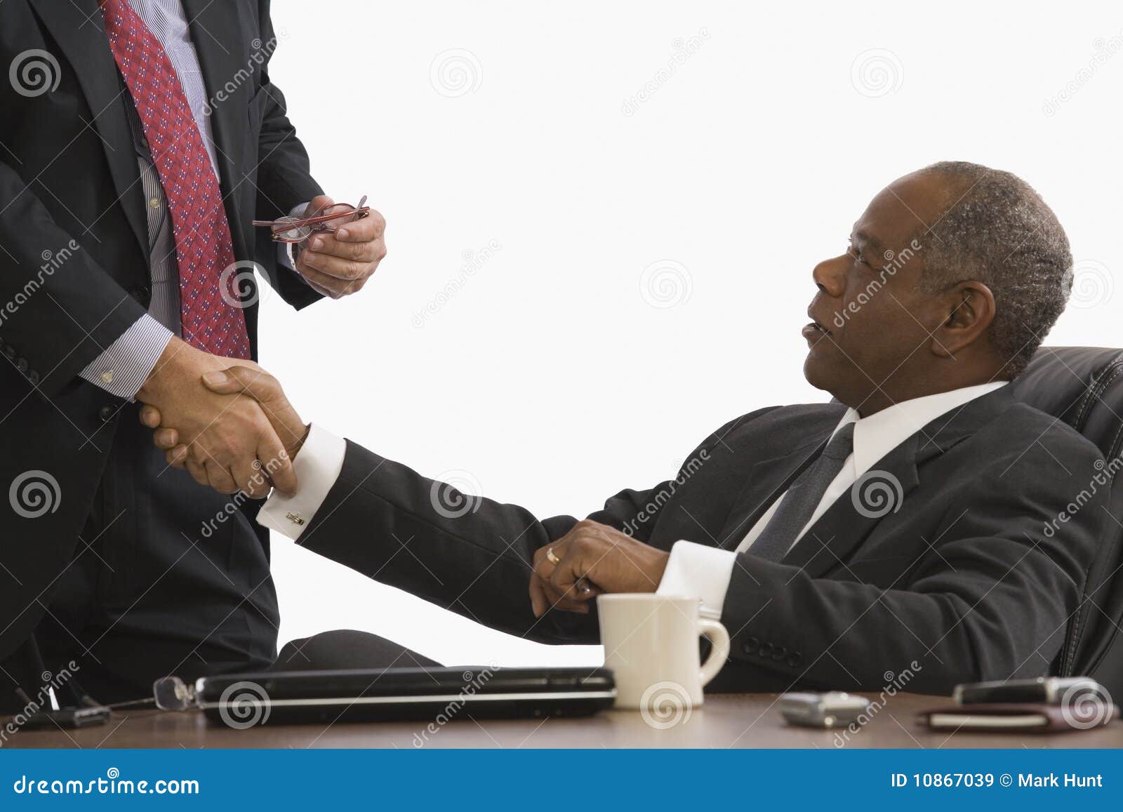 Two Executives Shaking Hands Stock Image - Image of office, looking ...