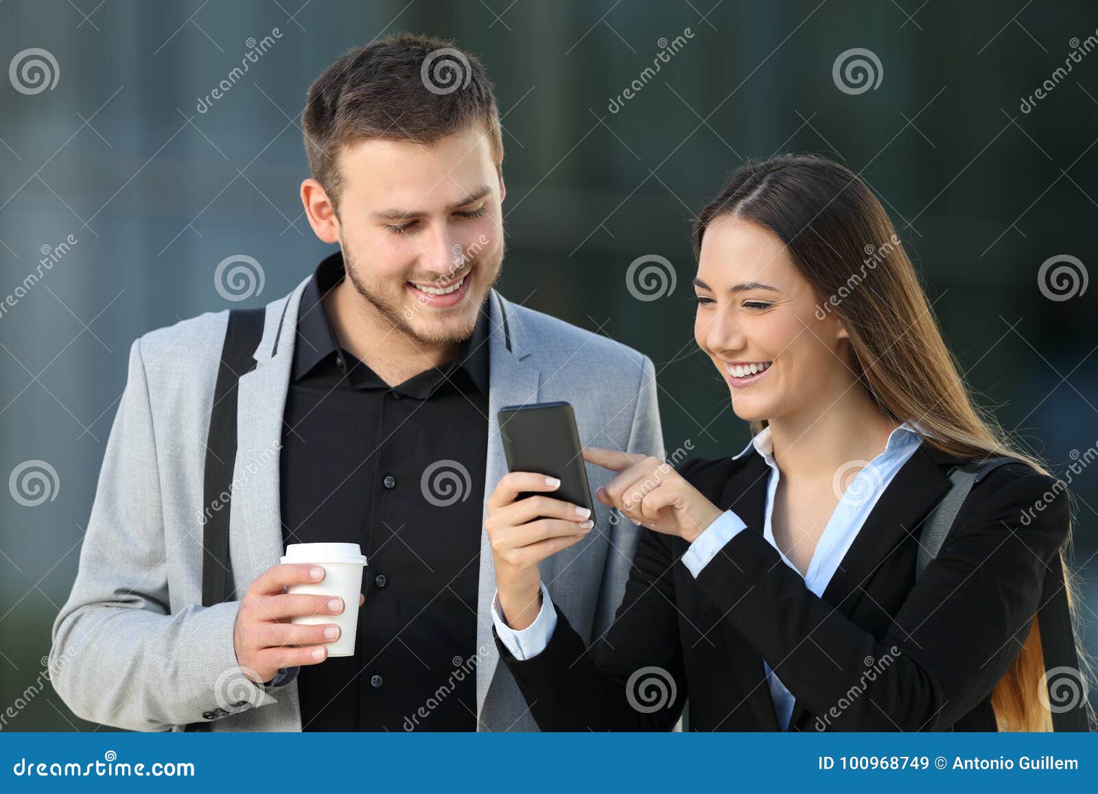 Two Executives Talking about Phone Content Stock Image - Image of ...