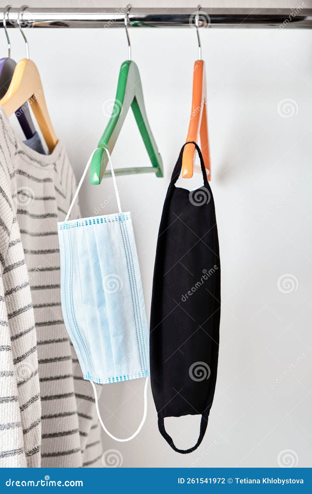 Two Face Mask Hangs in Wardrobe Along with Casual Clothes Stock Photo ...
