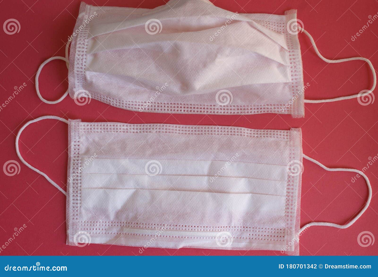 Two Face Masks on a Red Background Stock Photo - Image of blue, effect ...