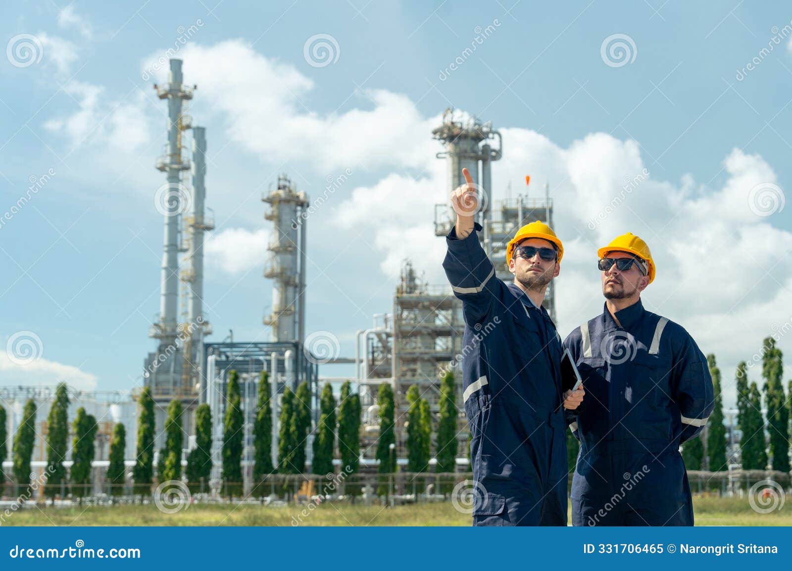 Two Factory Engineer or Technician Workers with One Hold Tablet and ...