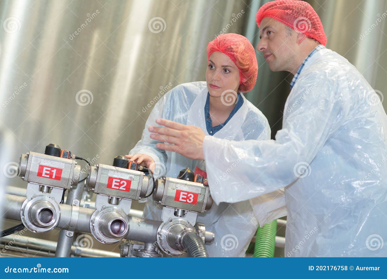 Two Factory Workers at Work Stock Photo - Image of contented ...