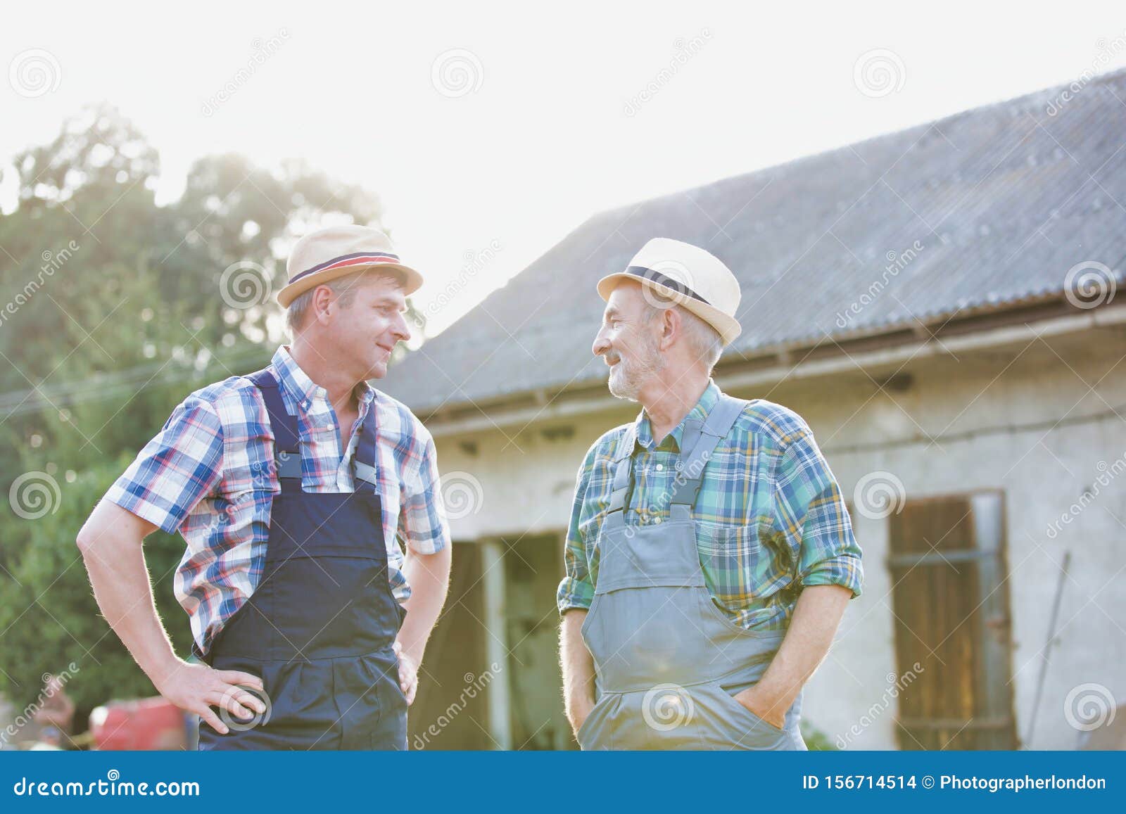 Two Farmers Talking Against Barn Stock Photo - Image of mature, diving ...