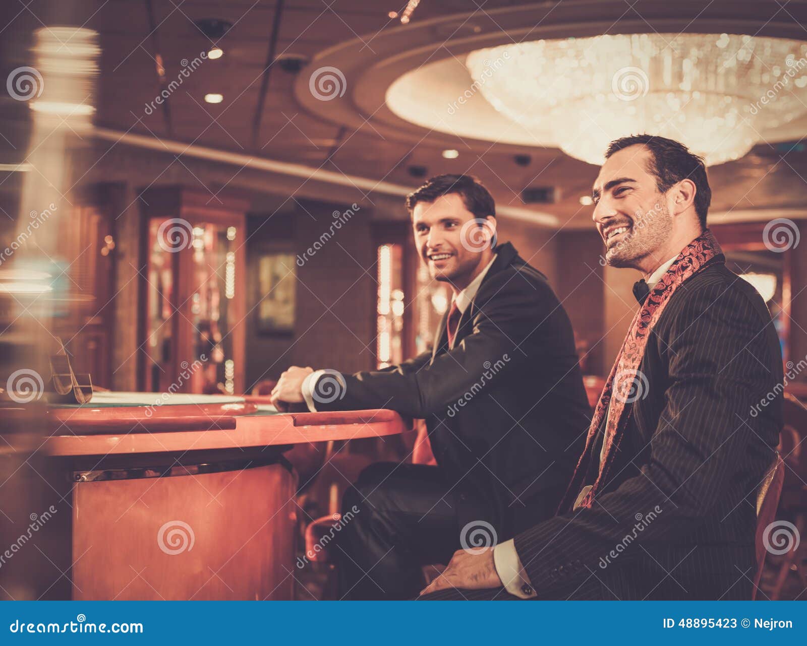 Two Fashionable Men Behind Table in a Casino Stock Image - Image of ...