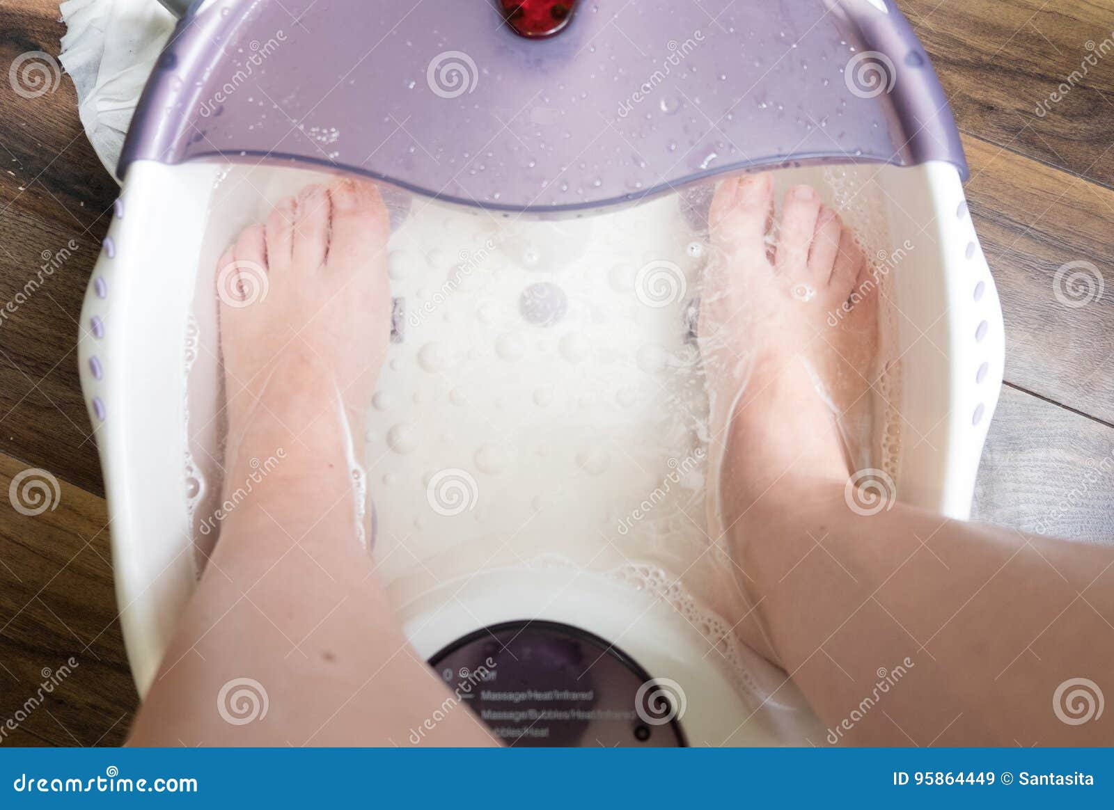 Two Feet Pampering Pedicure Wash In A Specialized Foot Spa With Massage ...
