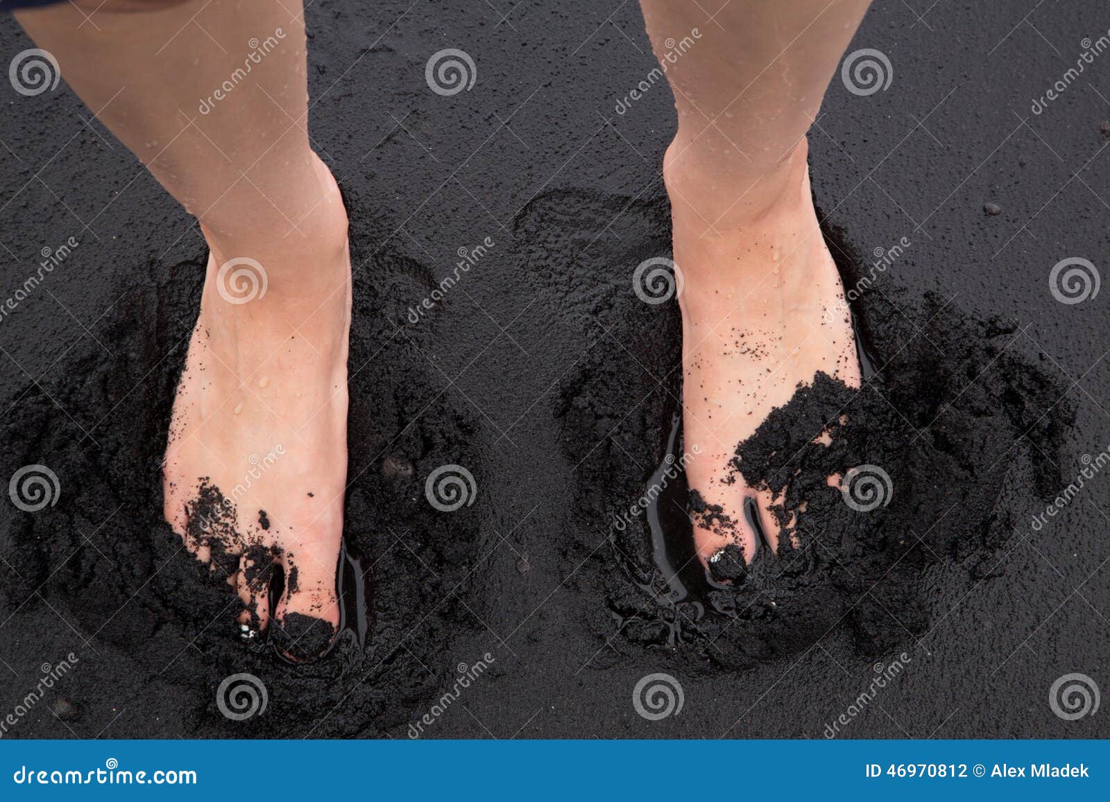 Two Feet Sinking into the Black Sand Stock Photo - Image of feet ...