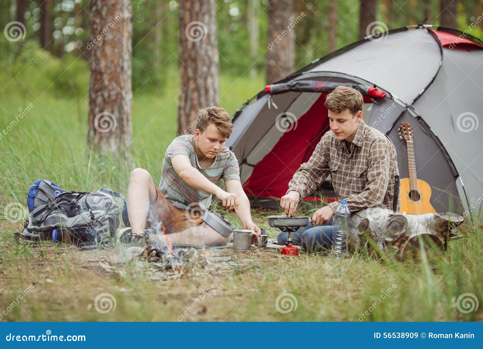 Two Fellow Campers Making Tea and Preparing Food by a Tent Stock Image ...