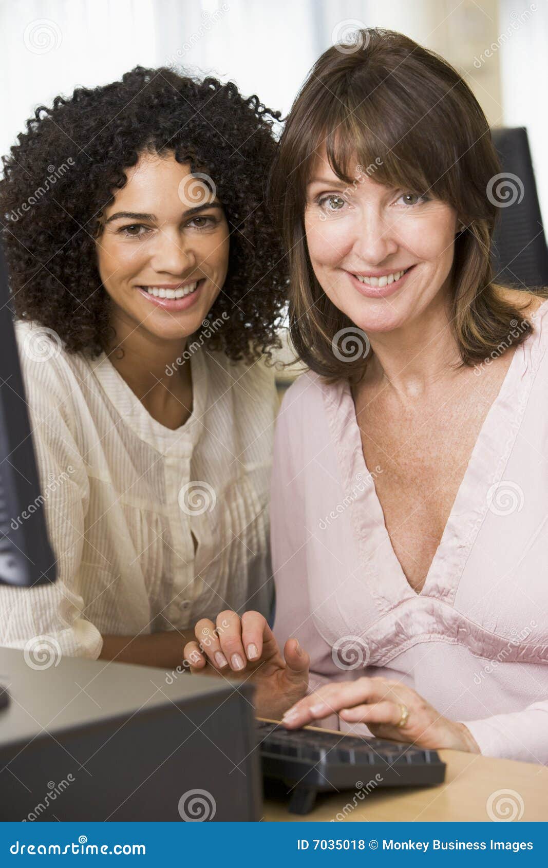 Two Female Adult Students Working on a Computer Stock Photo - Image of ...