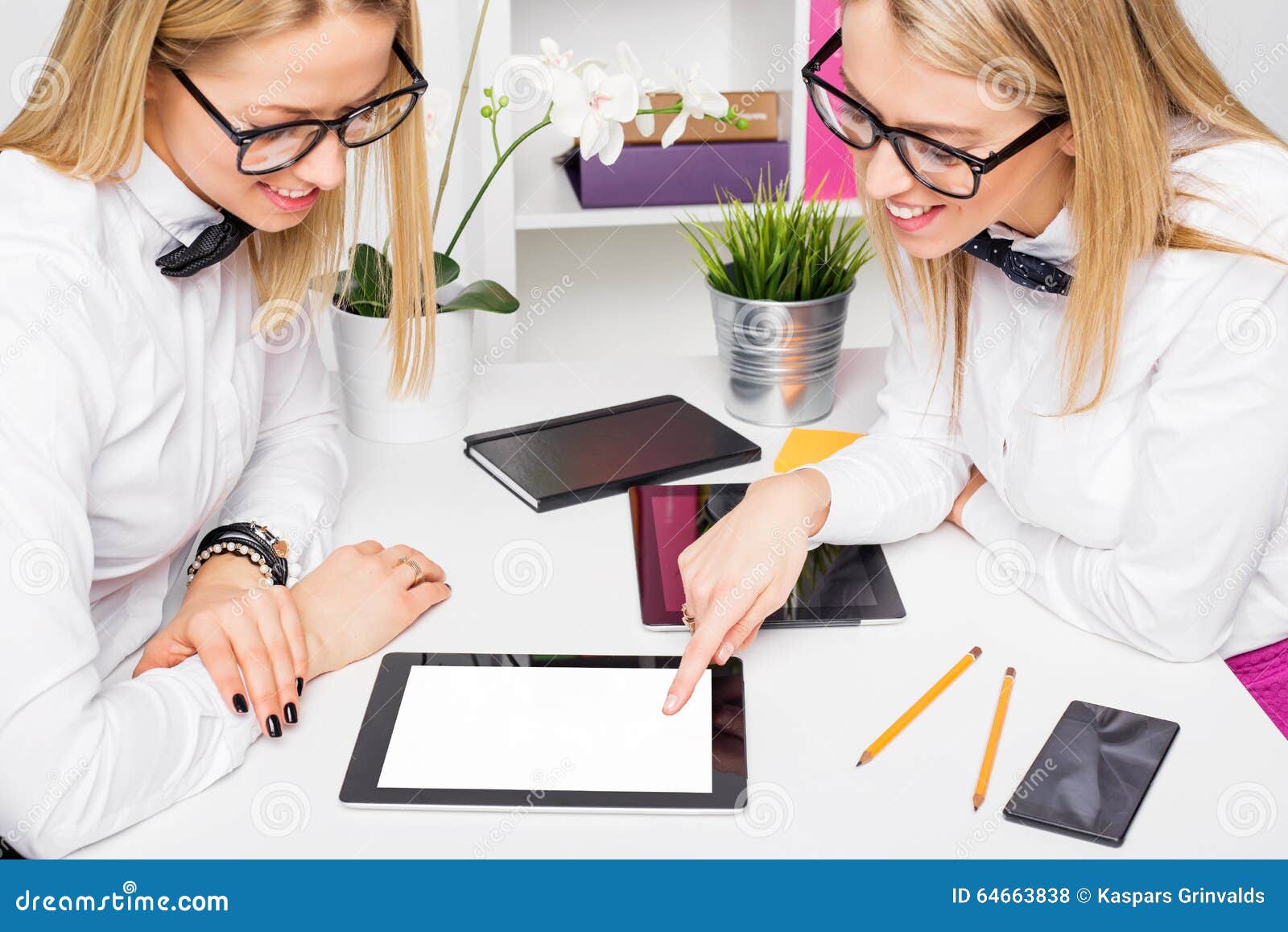 Two Female Co-workers Discussing the Project Stock Photo - Image of ...