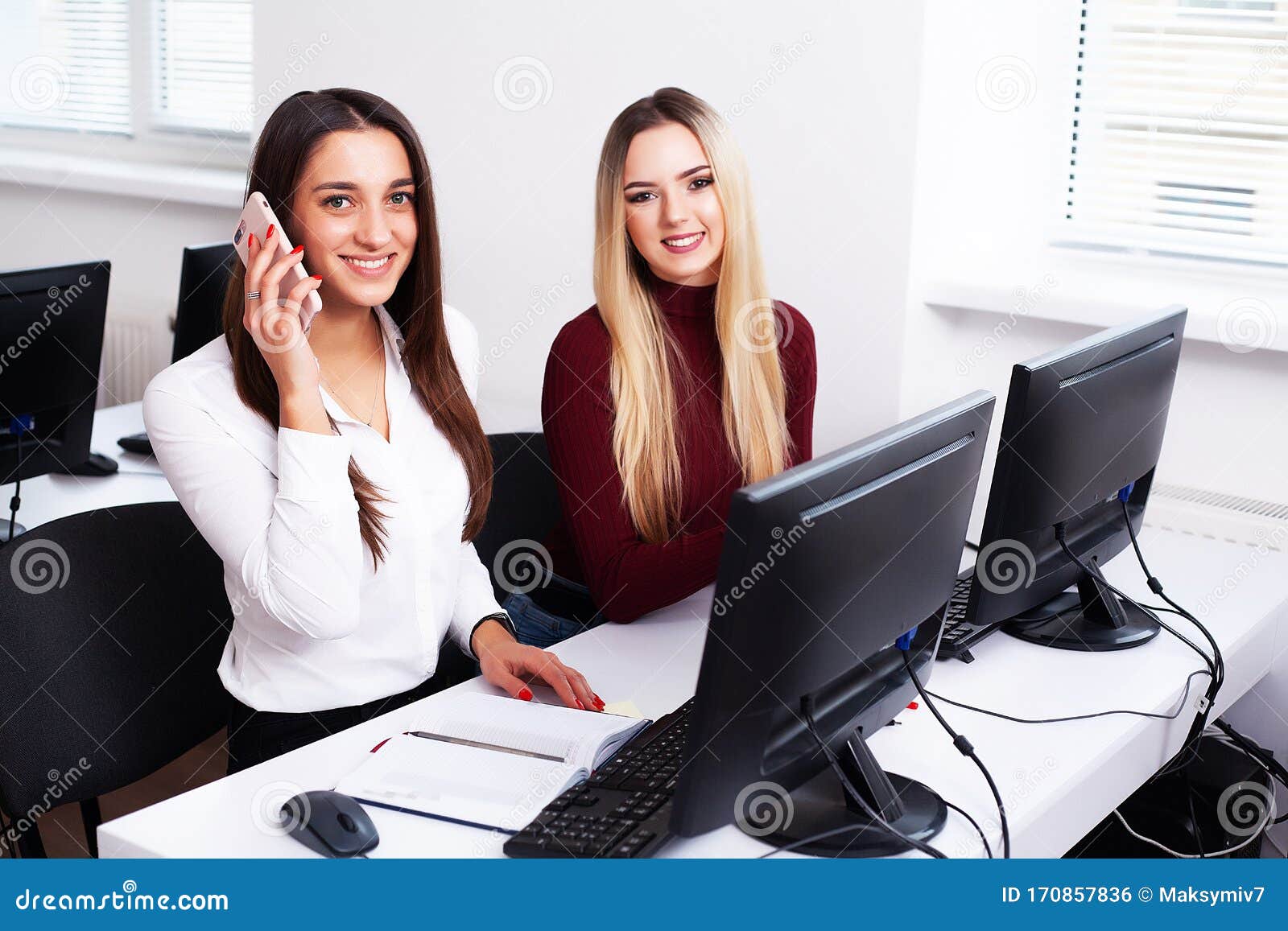 Two Female Colleagues in Office Working Together. Stock Photo - Image ...