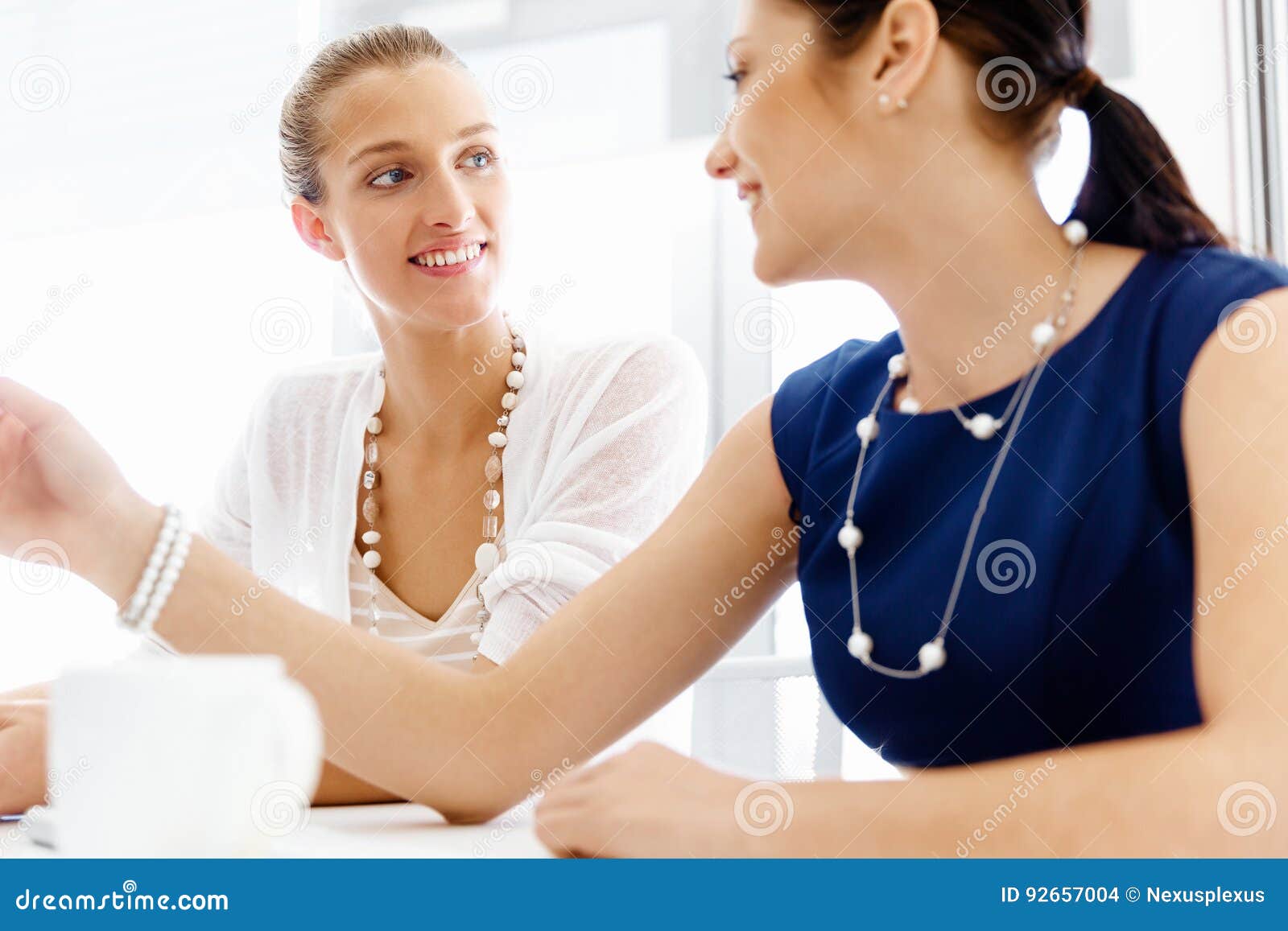 Two Female Colleagues in Office Stock Photo - Image of indoor ...