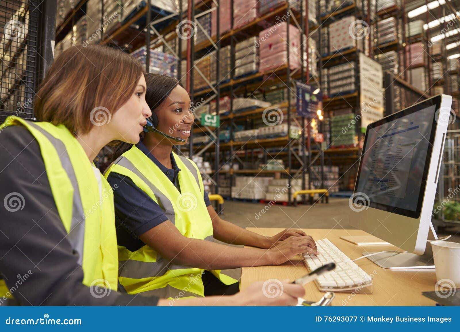 Two Female Colleagues Working in the Office of a Warehouse Stock Image ...