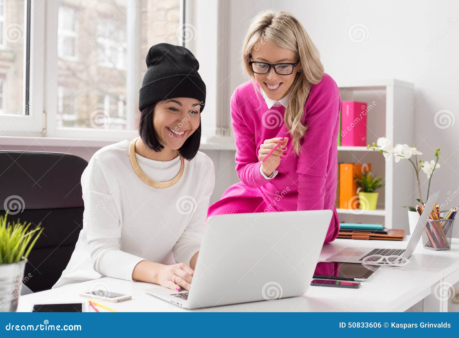 Two Female Colleagues Working Together in Office Stock Photo - Image of ...