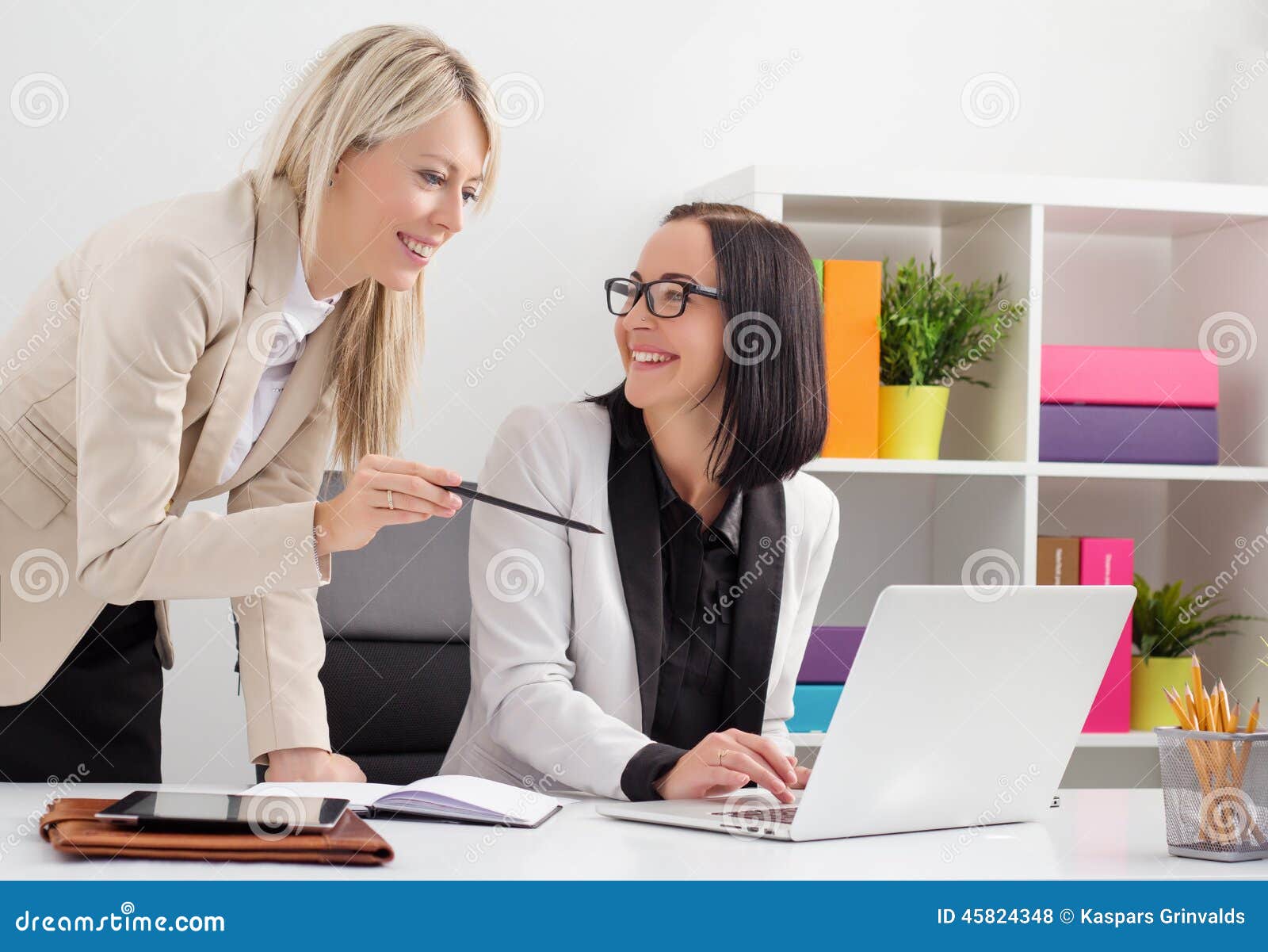 Two Female Colleagues Working Together Stock Photo - Image of female ...