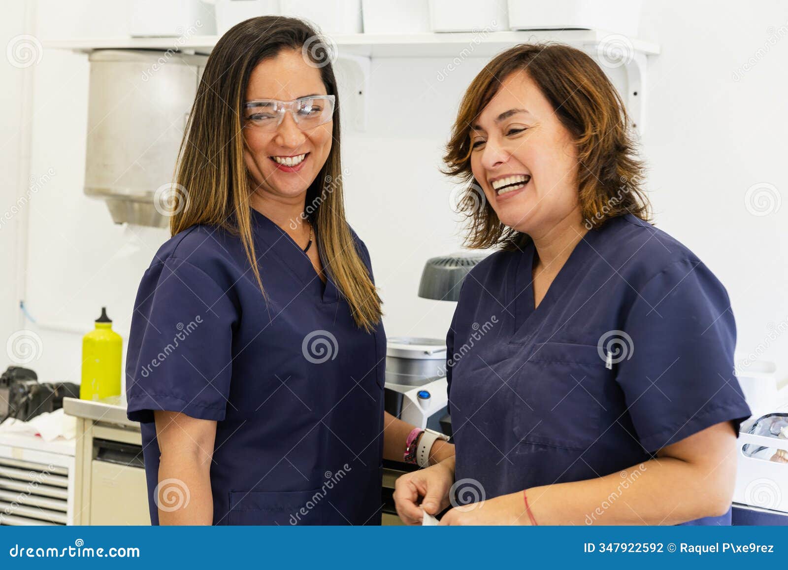 Two Female Dental Technicians Smiling in a Laboratory Stock Photo ...