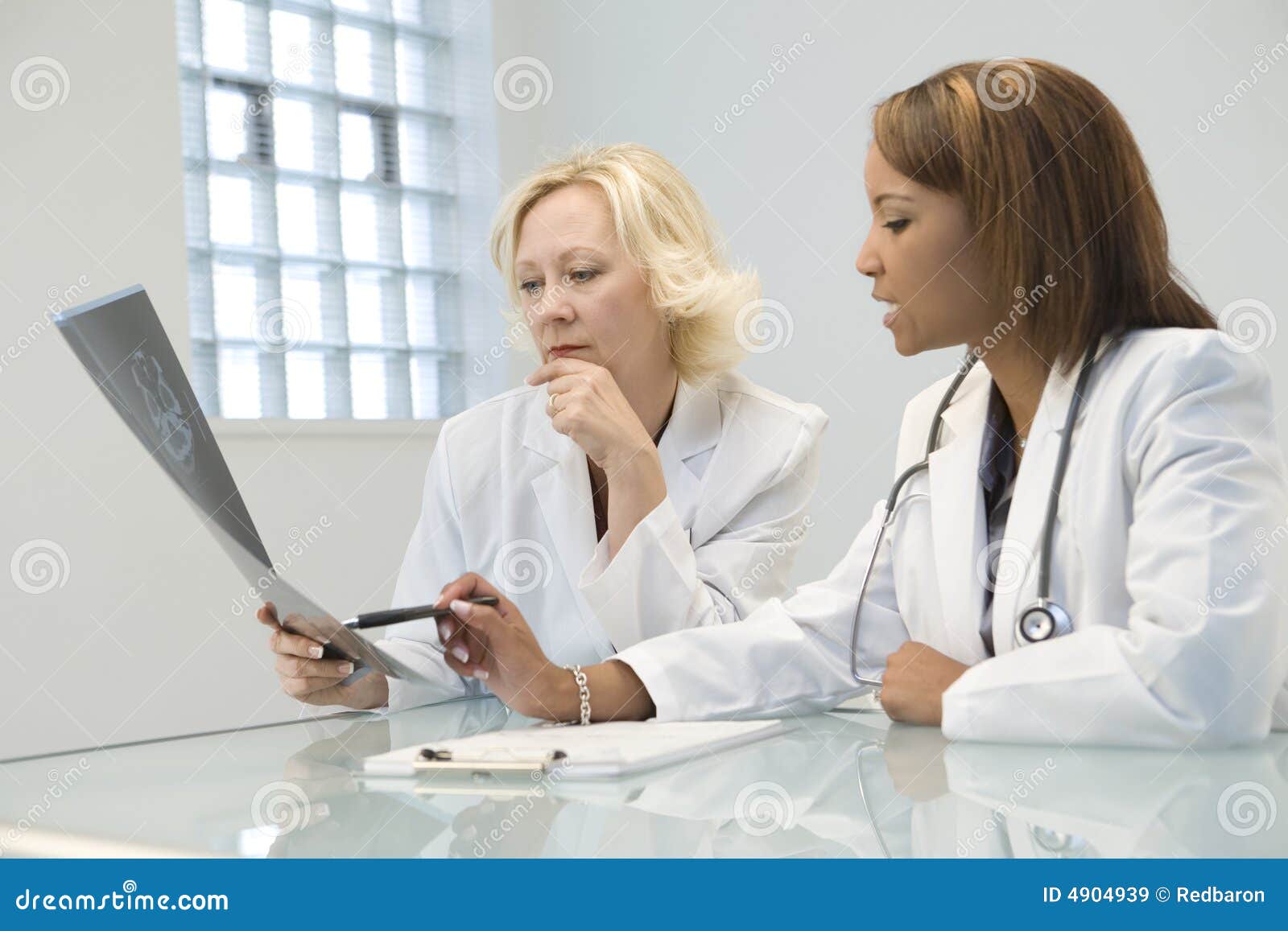 Female Doctors Hand Pointing At X-ray Medical Imaging At A Shoulder ...