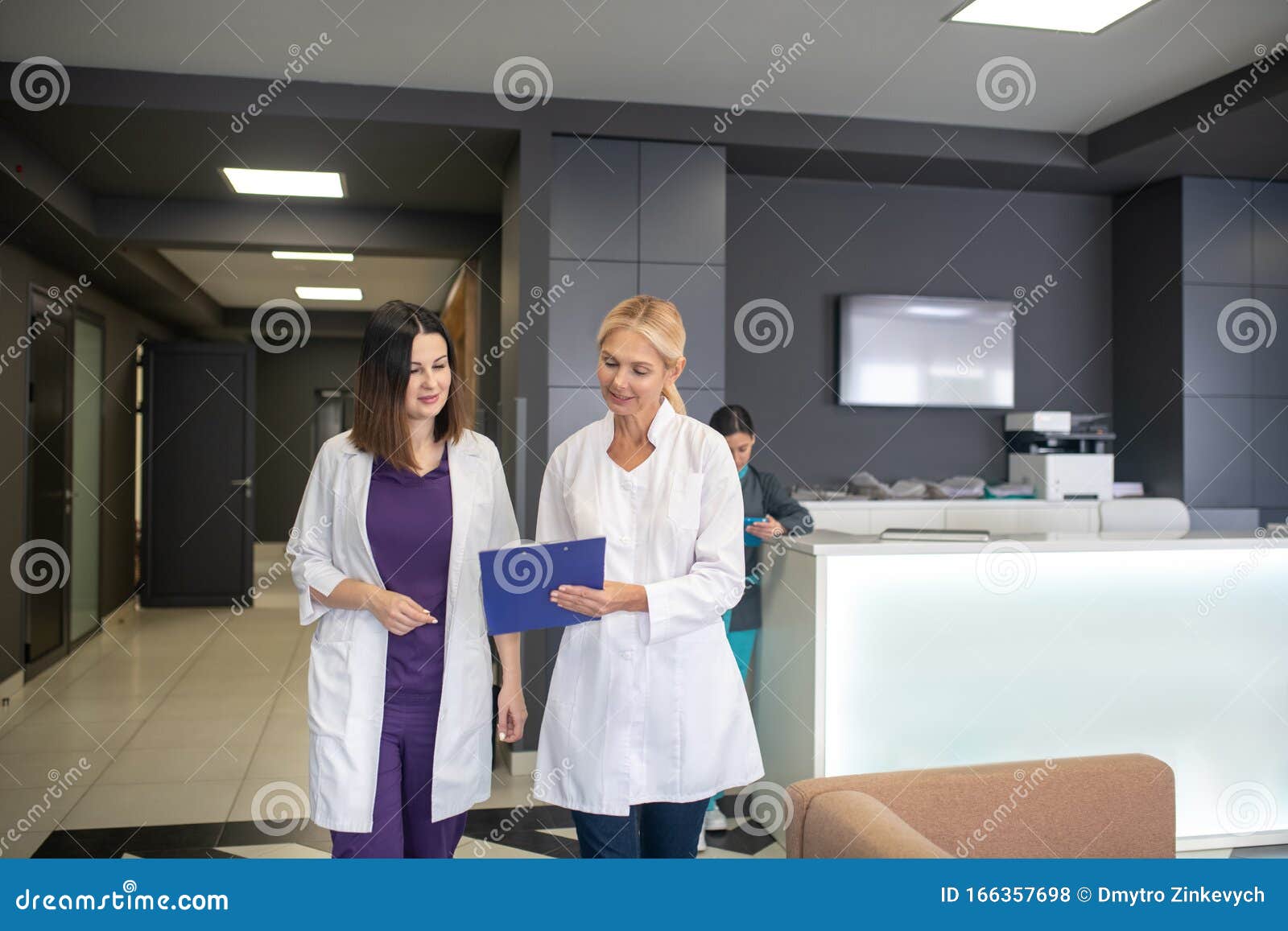 Two Female Doctors Talking in the Clinic Corridor Stock Photo - Image ...