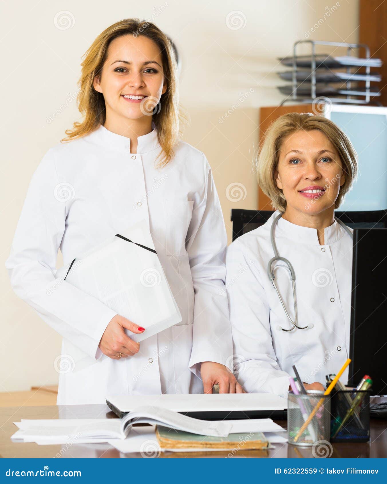 Two Female Doctors Working Together Stock Image - Image of indoors ...