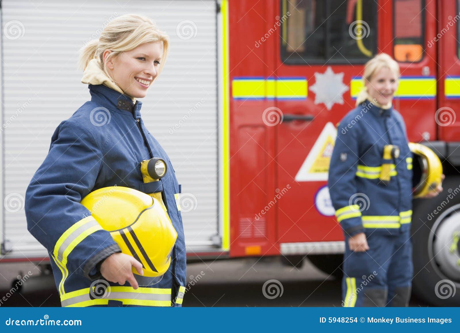 Two Female Firefighters by a Fire Engine Stock Photo - Image of female ...