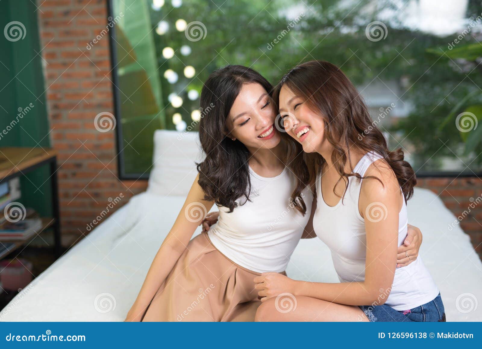 Two Female Friends in Lingerie on the Bed Stock Photo - Image of ...