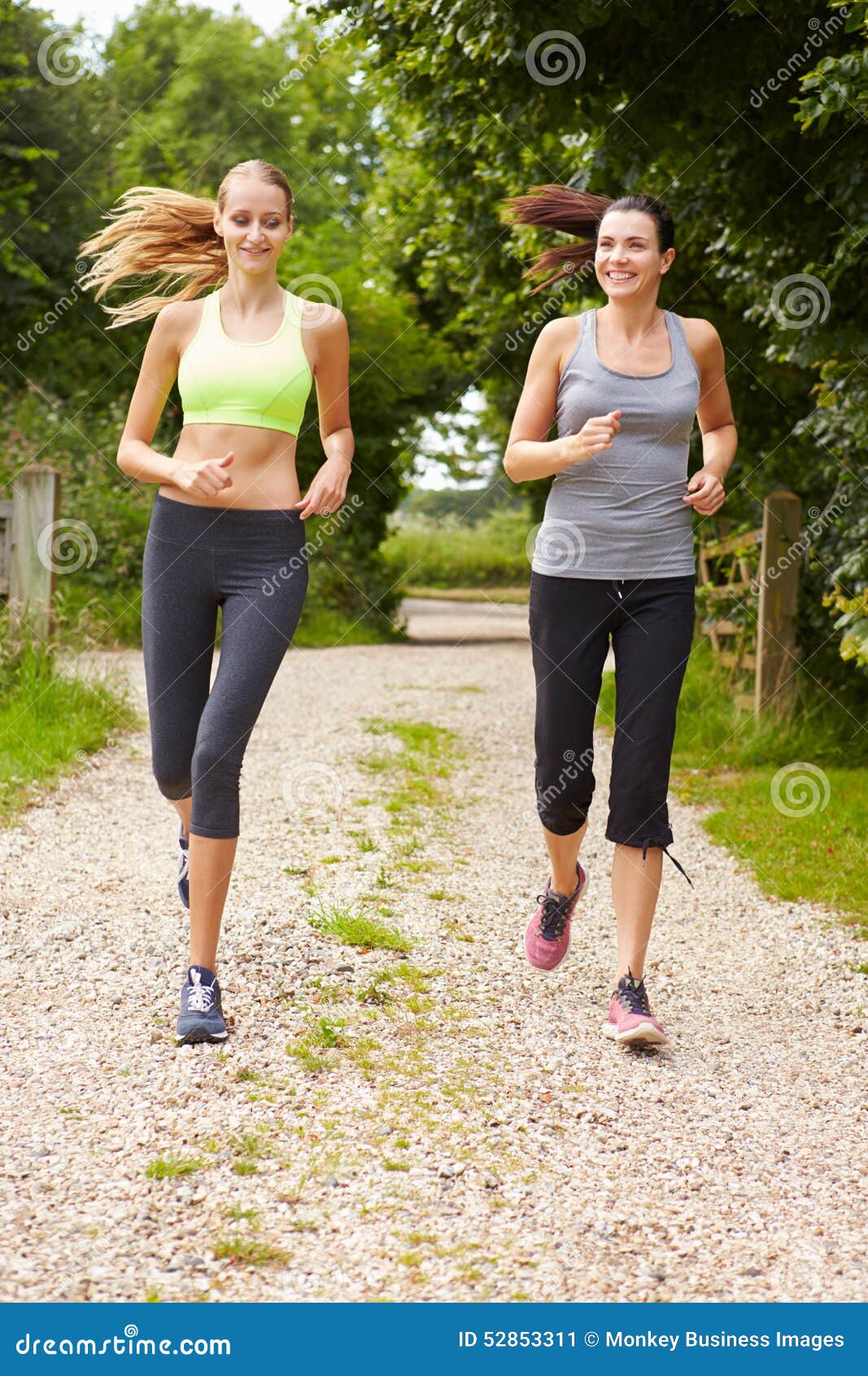 Two Female Friends on Run in Countryside Together Stock Image - Image ...