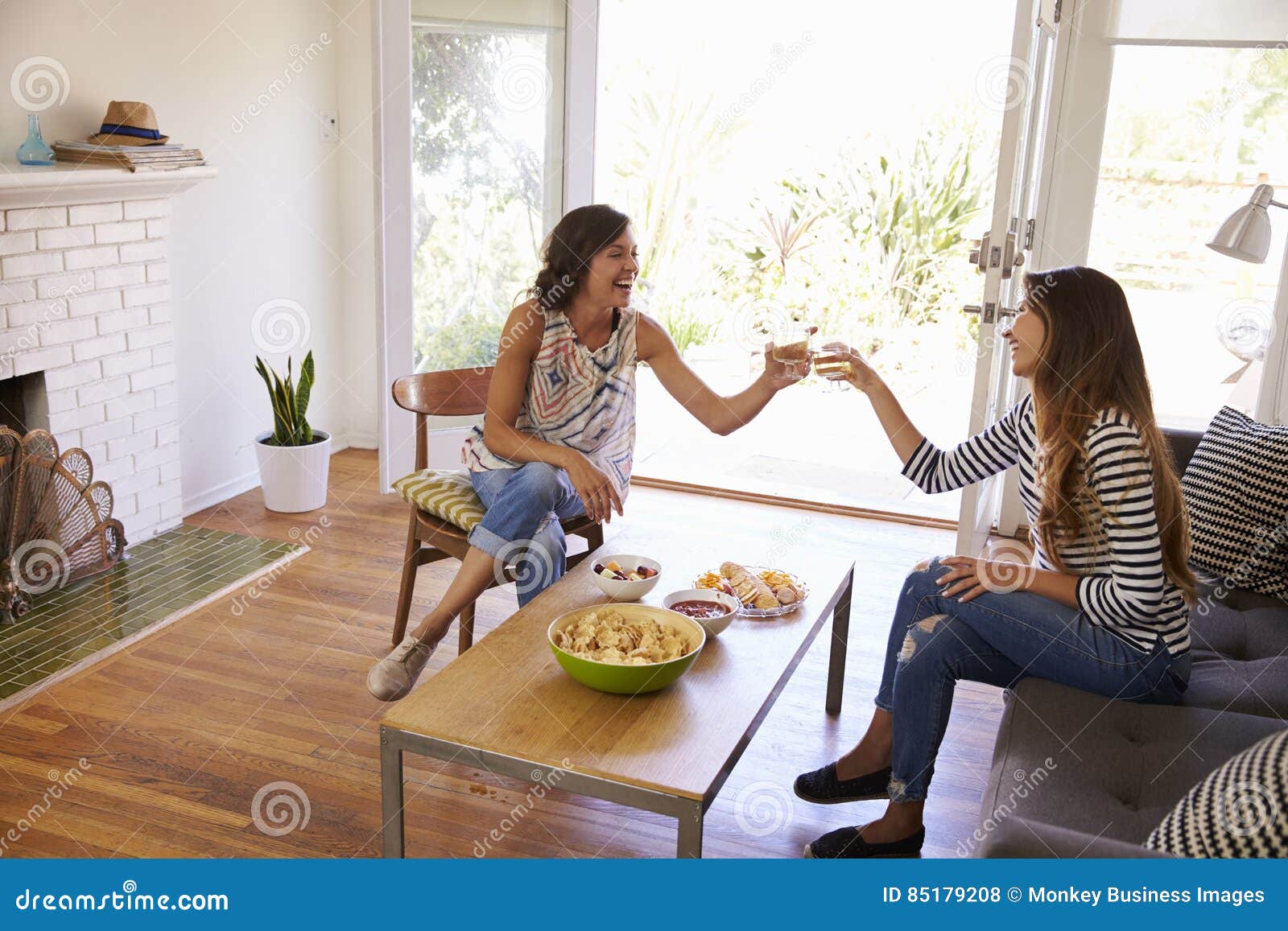 Two Female Friends Socializing Together at Home Stock Photo - Image of ...