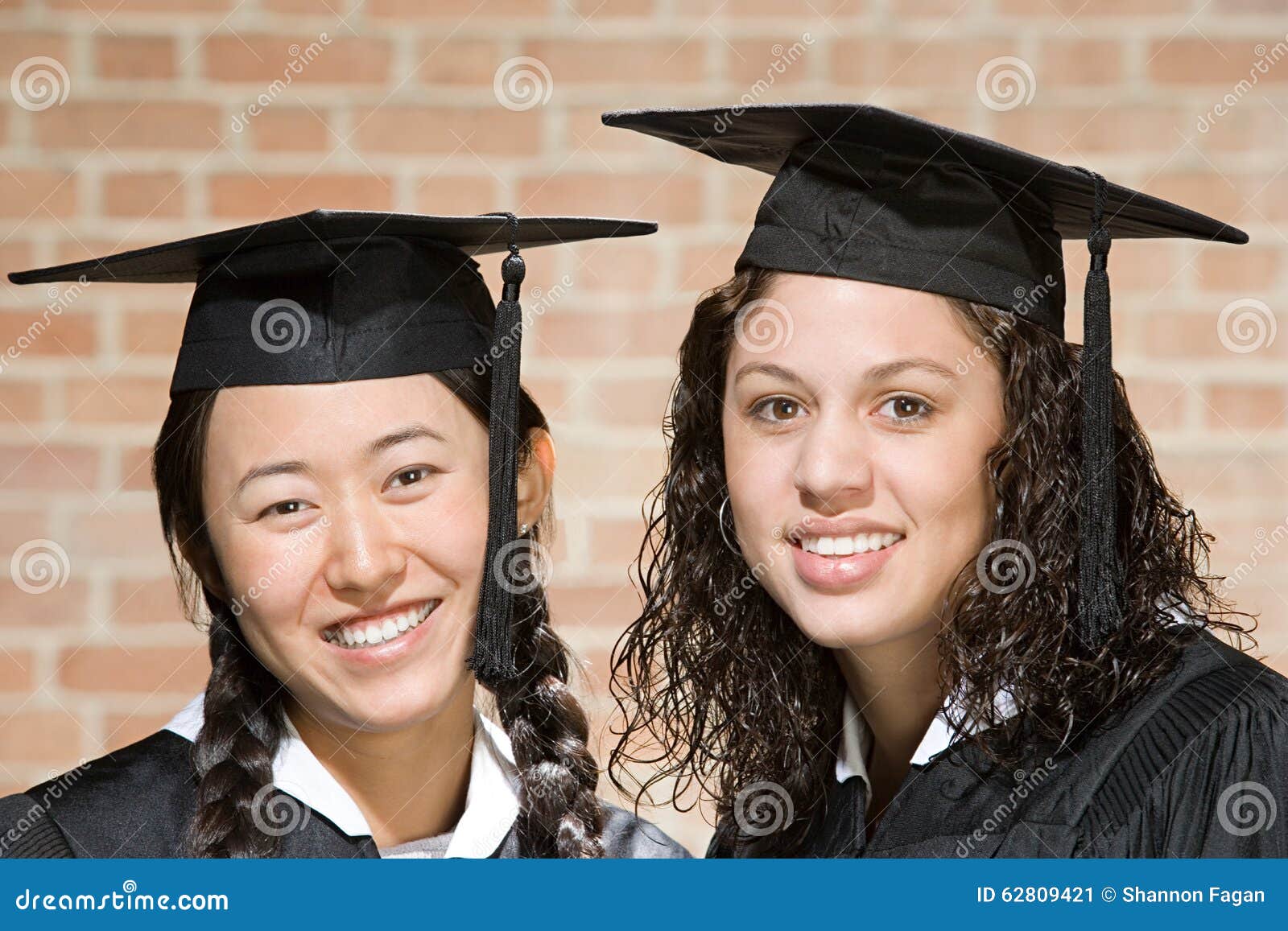 Two female graduates stock image. Image of classmates - 62809421