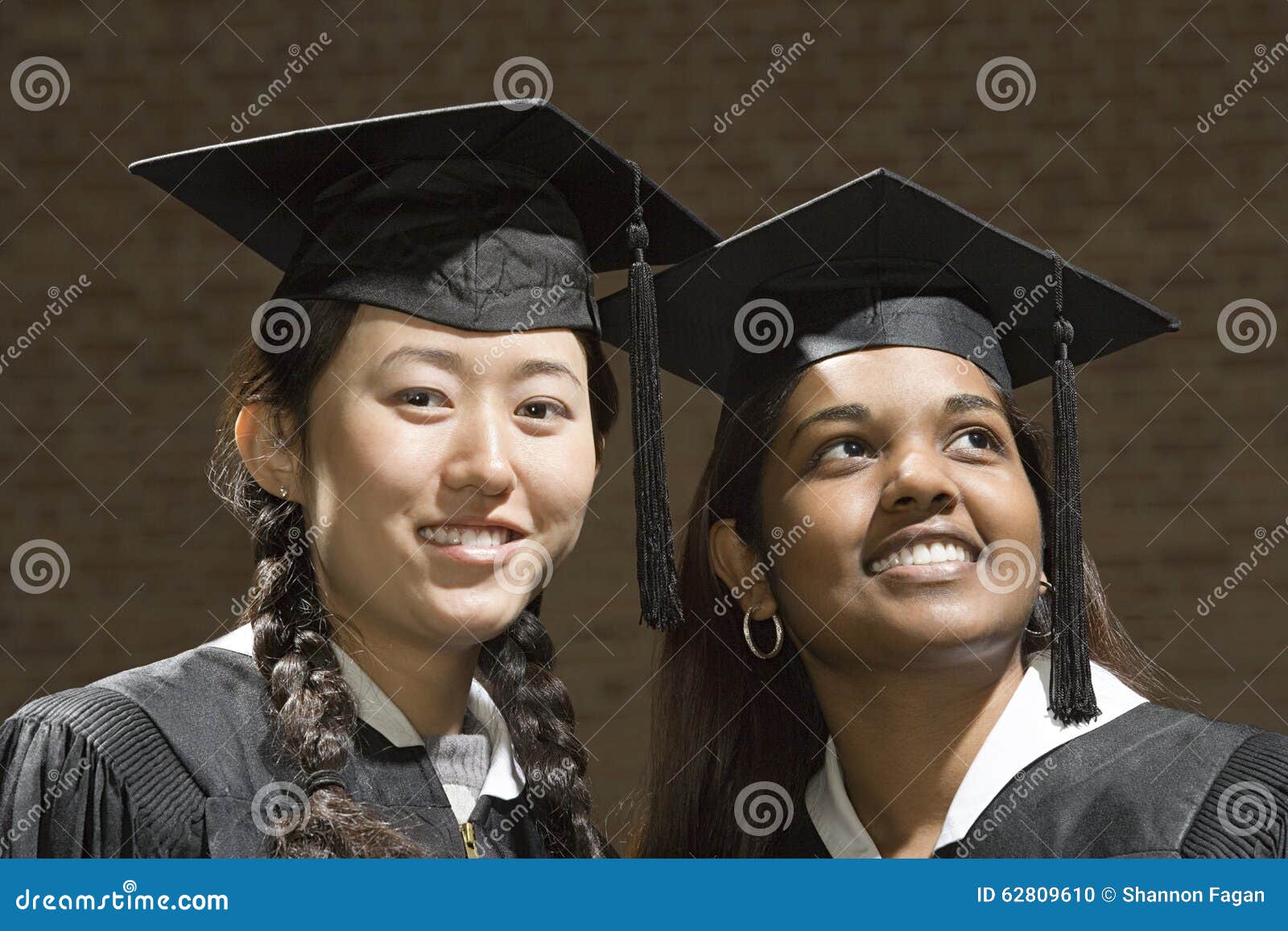 Two female graduates stock photo. Image of head, education - 62809610