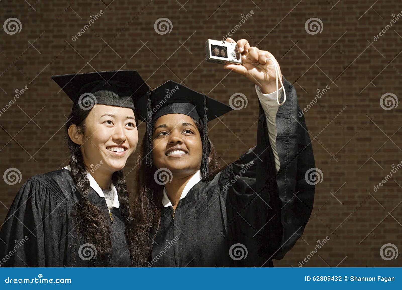 Two Female Graduates Taking a Photograph Stock Photo - Image of ...