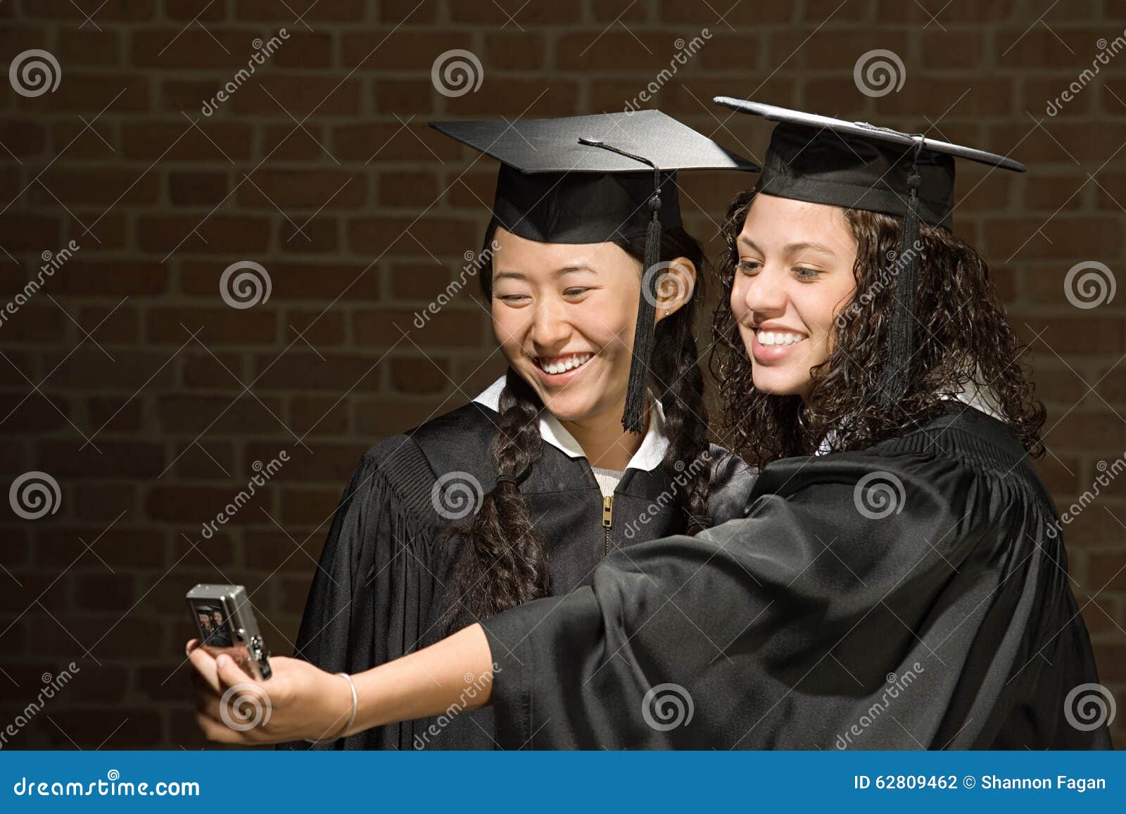 Two Female Graduates Taking a Photograph Stock Photo - Image of ...