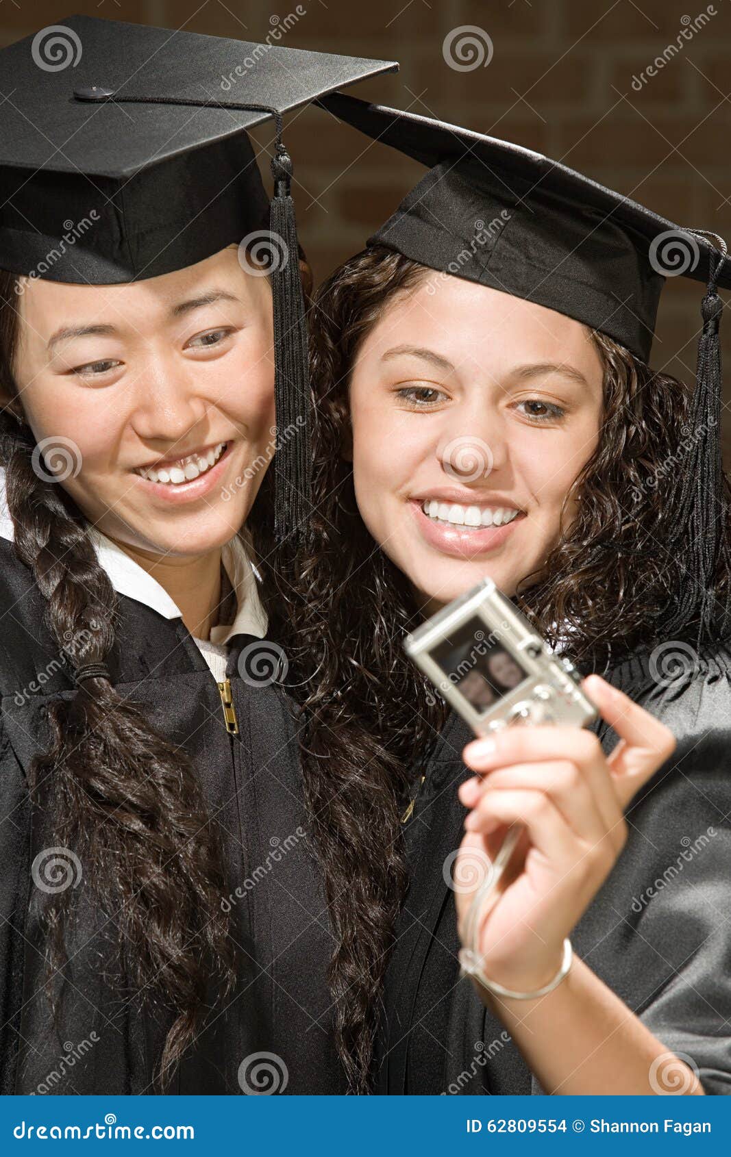 Two Female Graduates Taking a Photograph Stock Photo - Image of ...