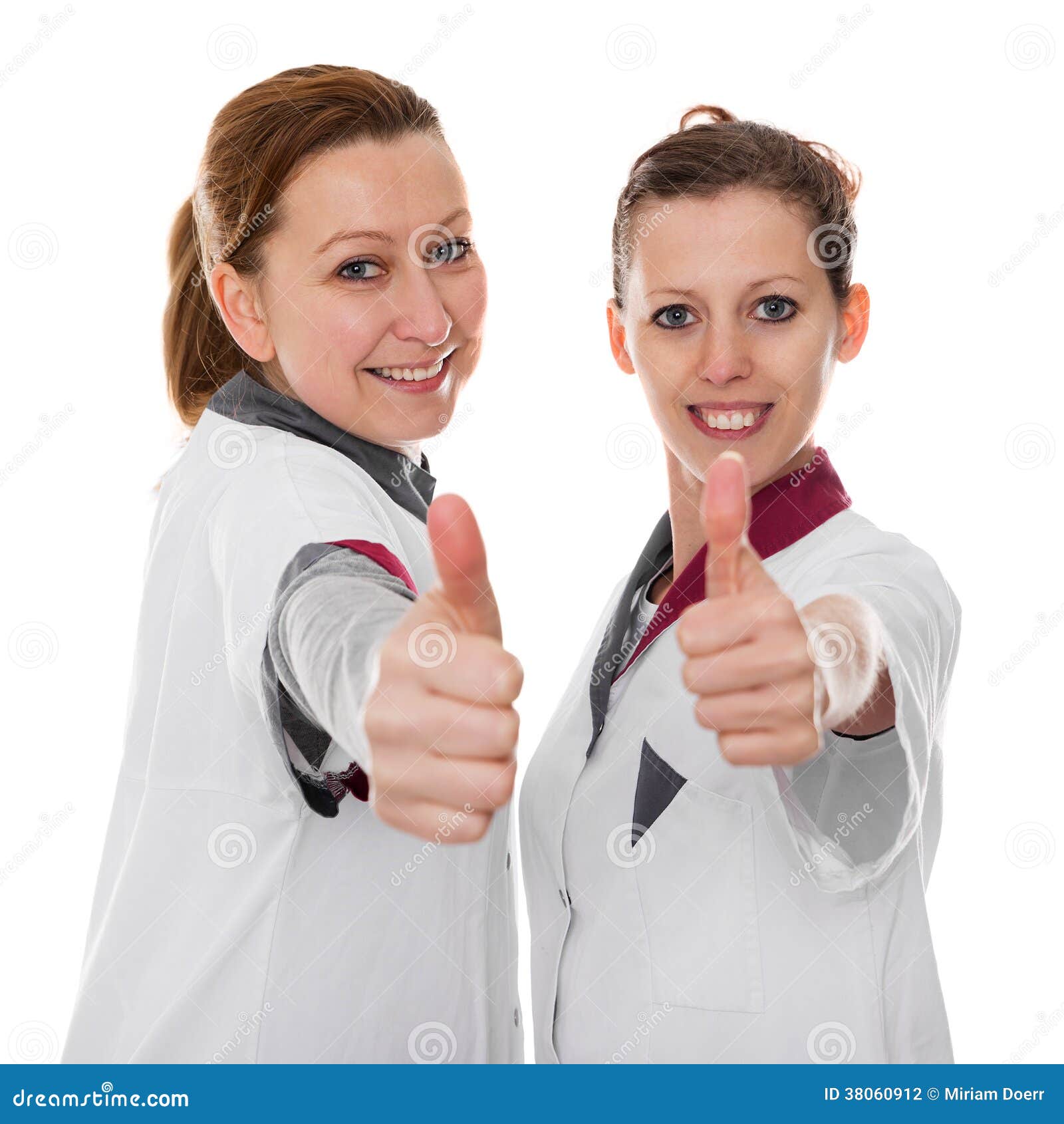 Two Female Nurses Showing Success Stock Photo - Image of care, indoors ...