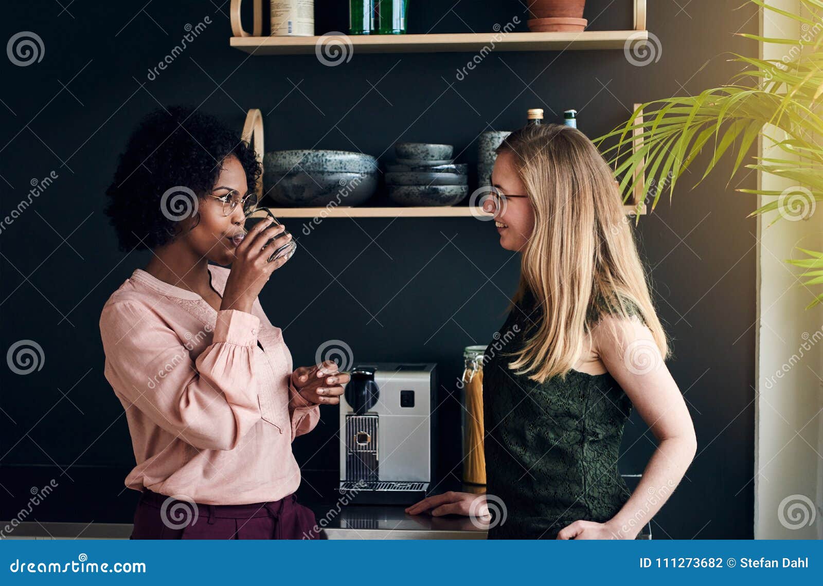 Two Female Office Colleagues Talking Together during a Break Stock ... Two Female Office Colleagues Talking Together during a Break Stock ...