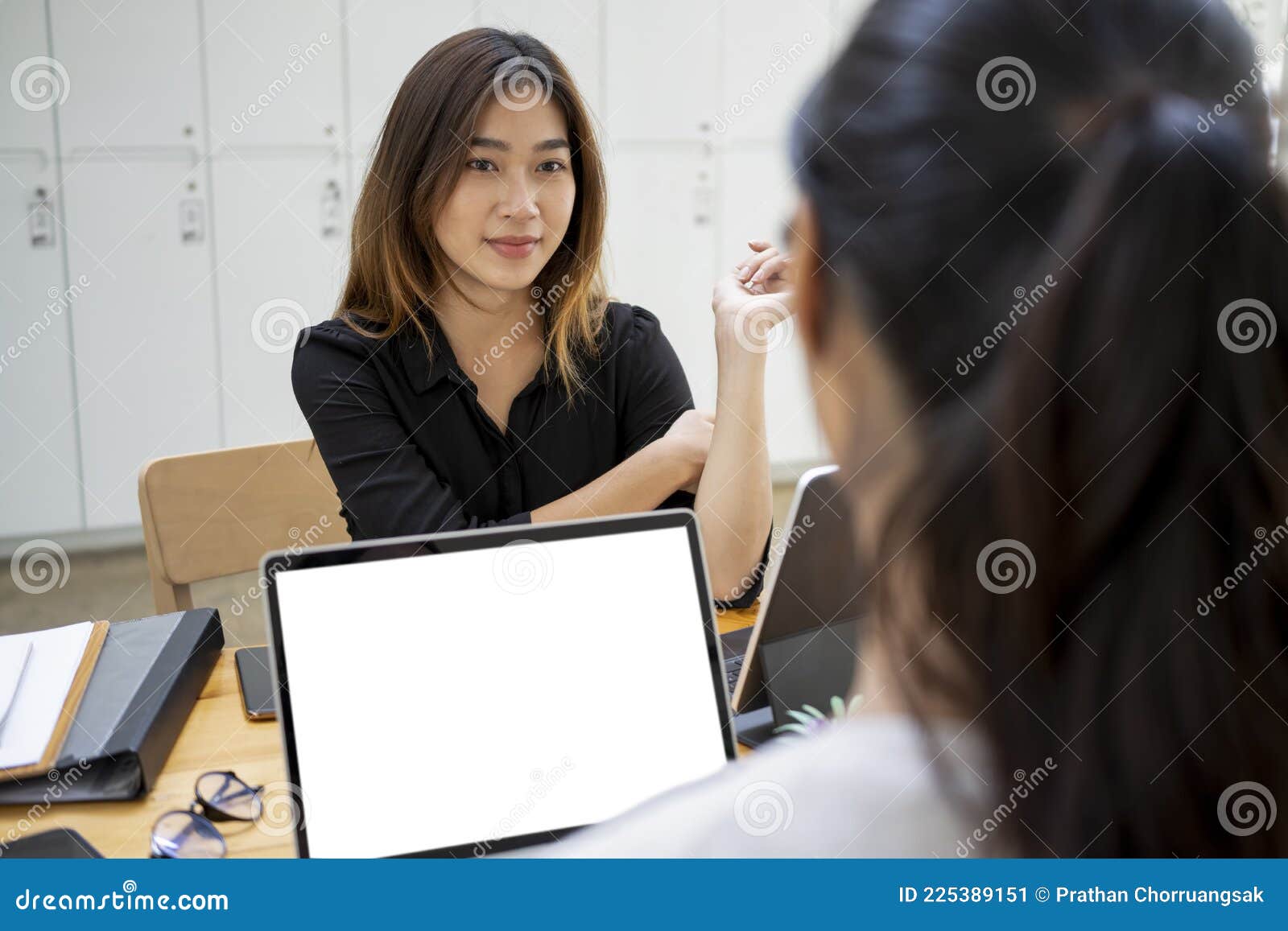 Two Female Office Workers Discussing Their New Project at Office. Stock ...