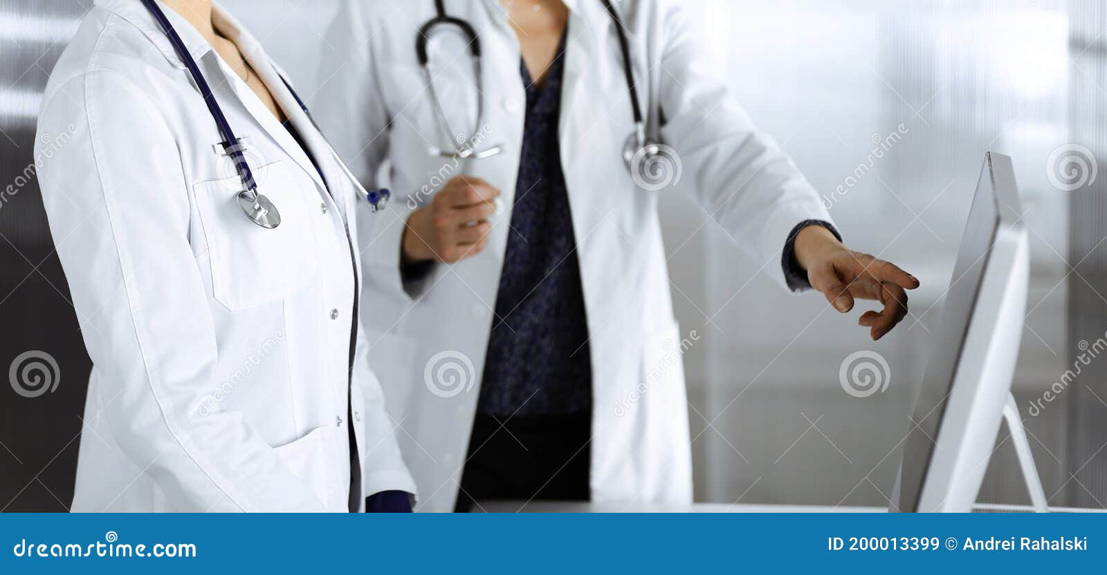 Two Female Physicians are Discussing Medical Therapy, while Standing at ...