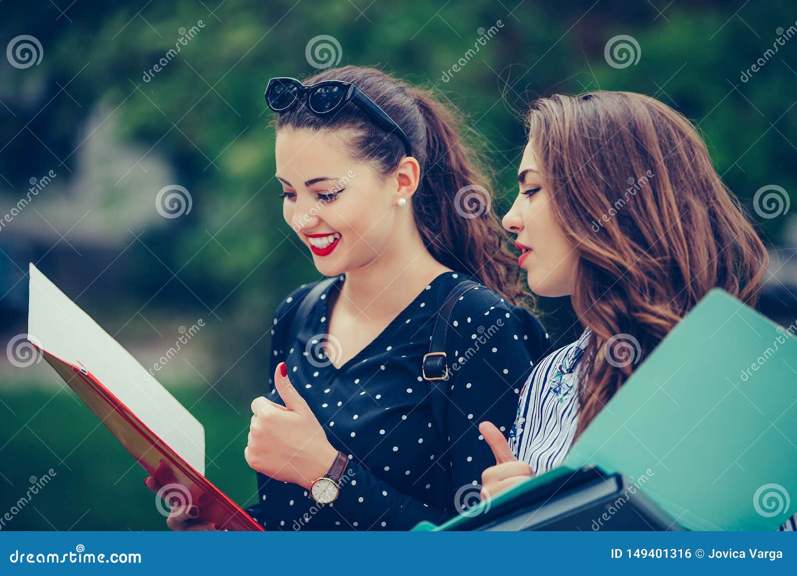 Two Female Students Checking Paper Notes before Exam Stock Photo ...