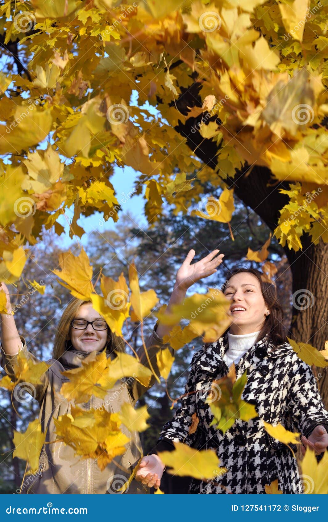 Two Female Students Resting in the Autumn Park Stock Photo - Image of ...