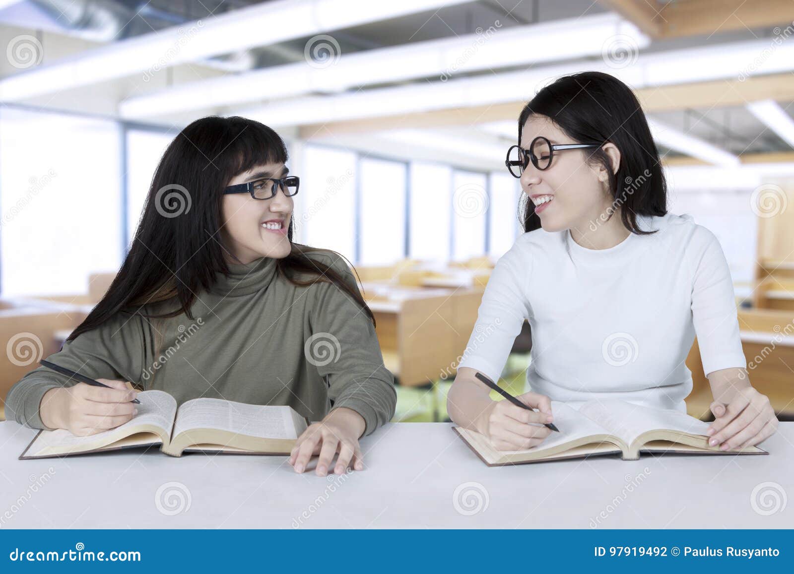 Two Female Students Studying in the Classroom Stock Photo - Image of ...