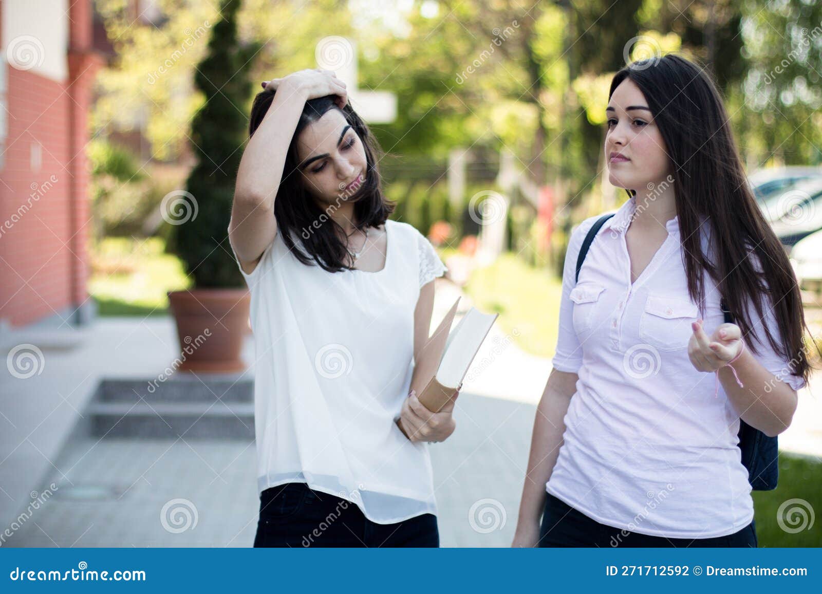 Two Female Students Talking about Their Struggles on the Campus Stock ...