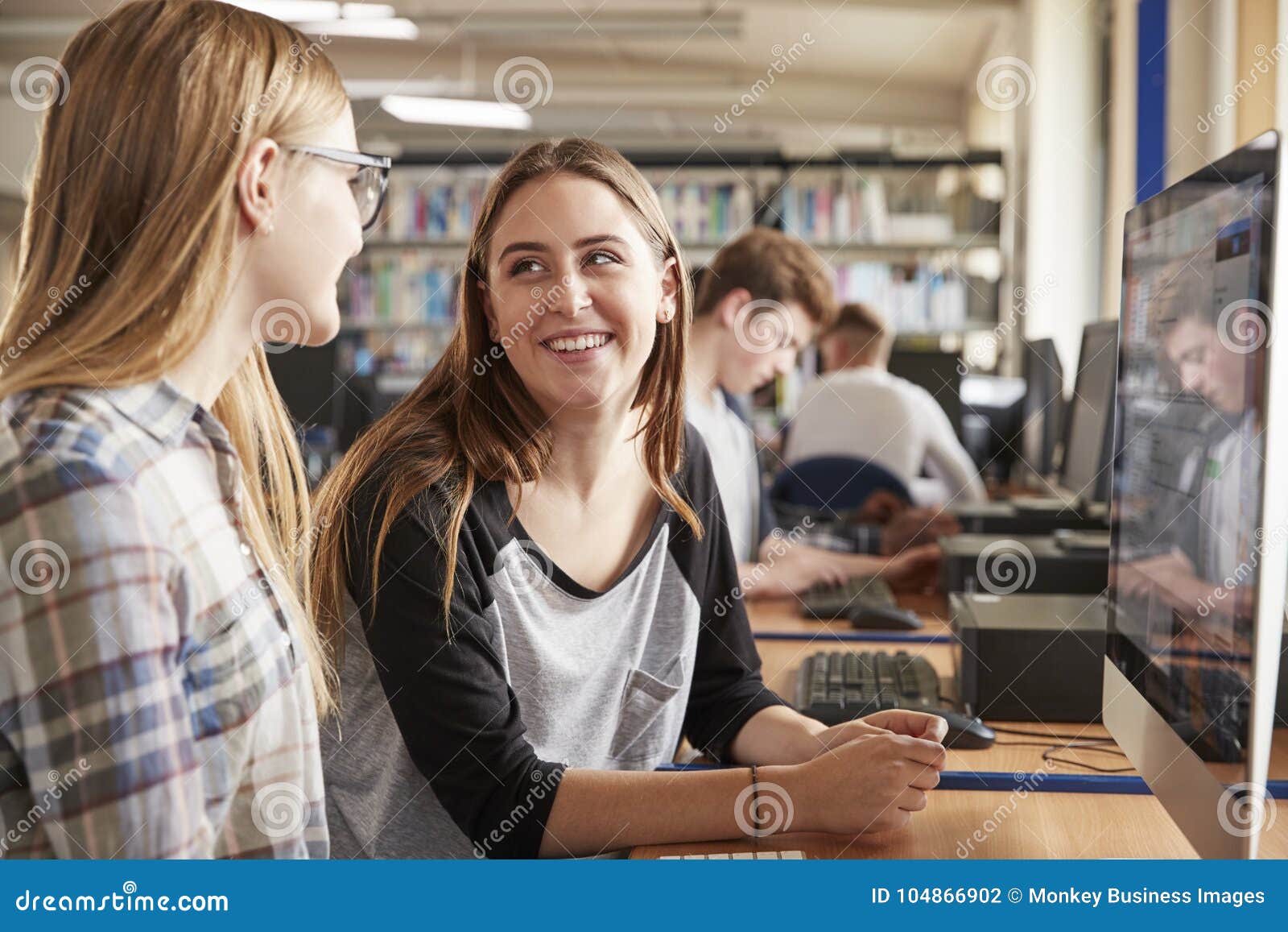 Two Female Students Working on Computer in College Library Stock Photo ...