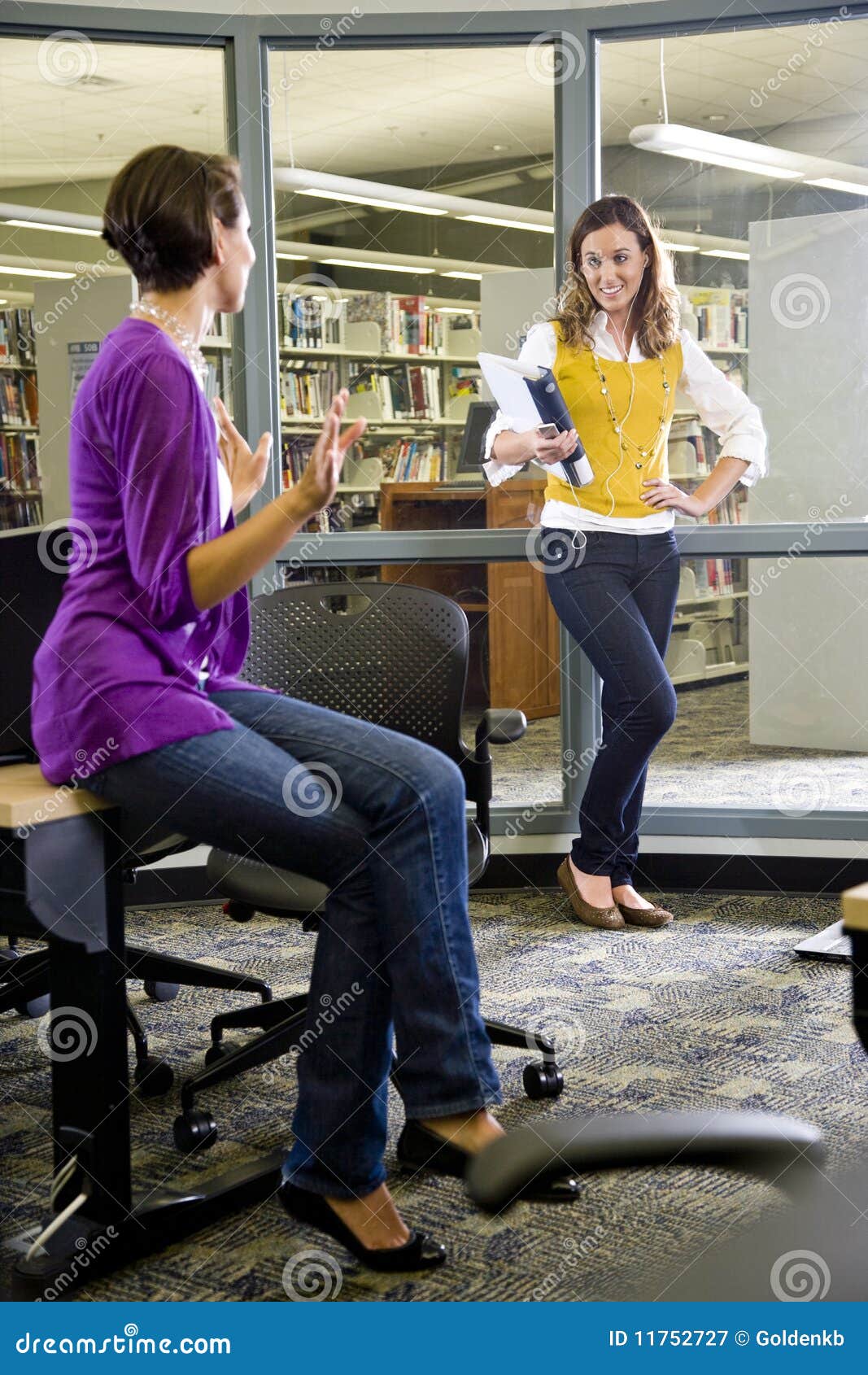 Two Female University Students Talking in Library Stock Image - Image ...