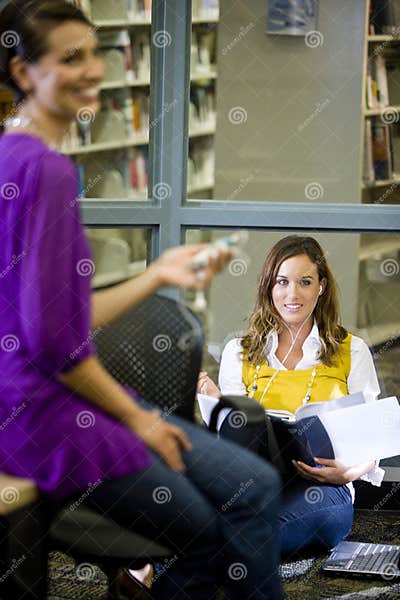 Two Female University Students Talking in Library Stock Photo - Image ...