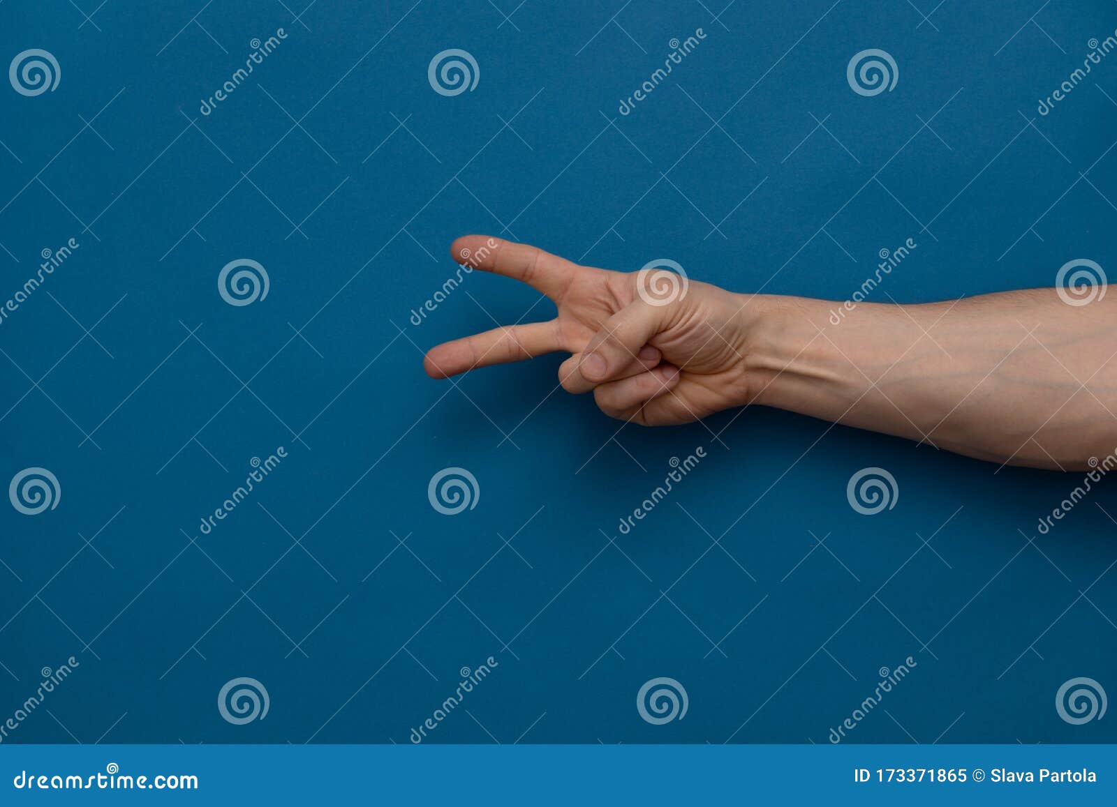 Two Fingers on a Blue Background Stock Image - Image of point, showing ...