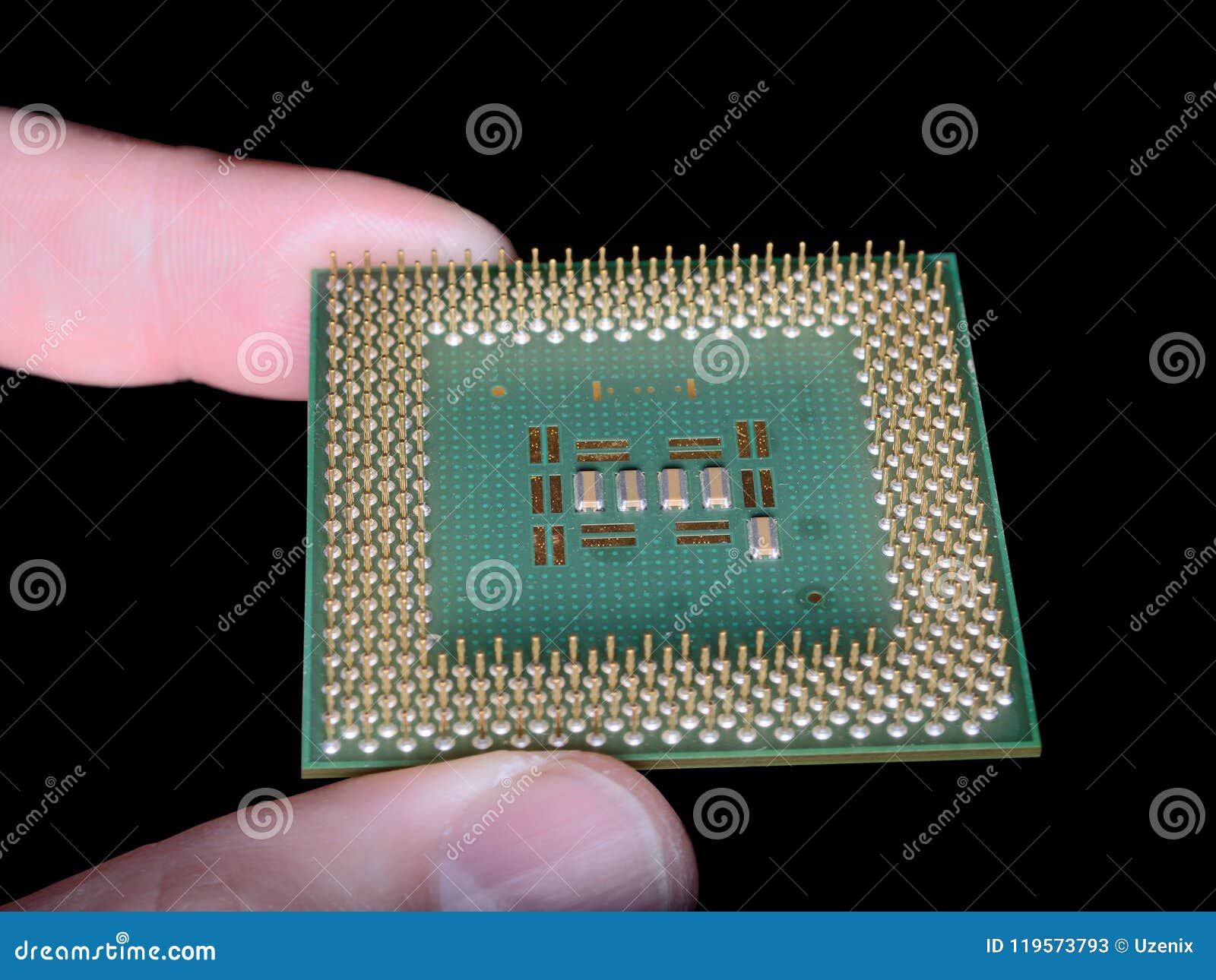 Two Fingers Hold the CPU Processor on a Black Background Stock Image ...