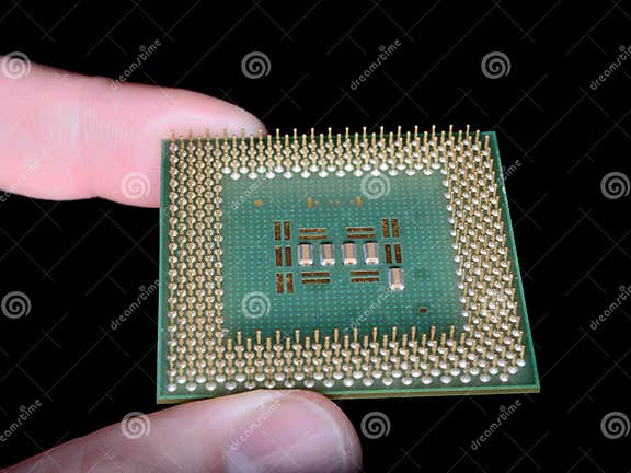 Two Fingers Hold the CPU Processor on a Black Background Stock Image ...