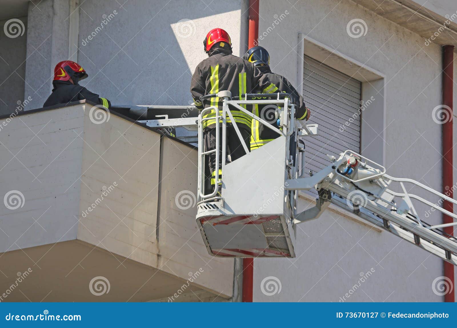 Two Firefighters in the Cage of Fire Engine Stock Image - Image of gear ...