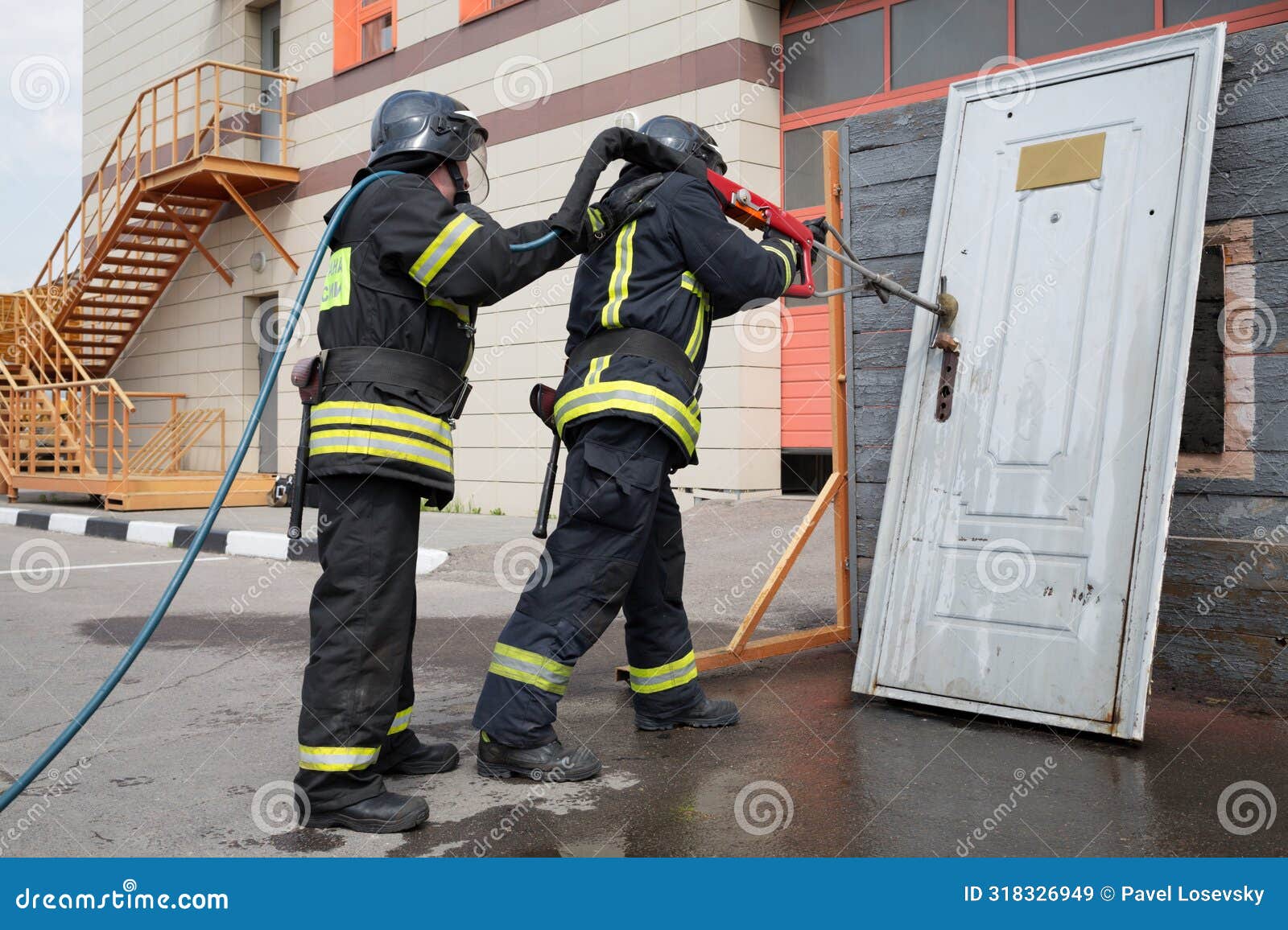 Two Firefighters Demonstrate Lock Snapping with Stock Image - Image of ...