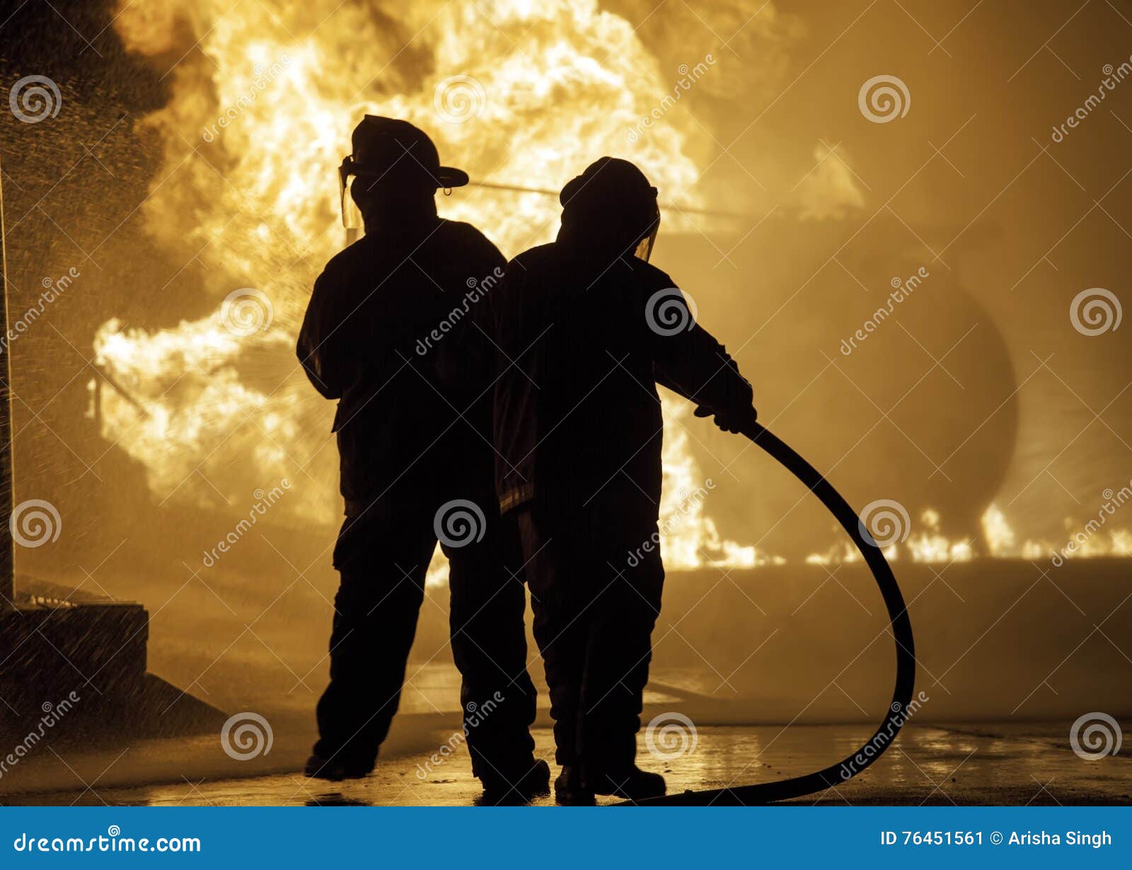 Two Firefighters Standing in Front of a Fire with Hose Editorial Photo ...