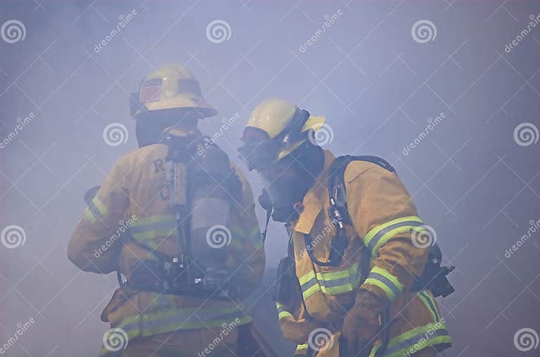 Two Fireman Engulfed in Smoke Stock Image - Image of public ...